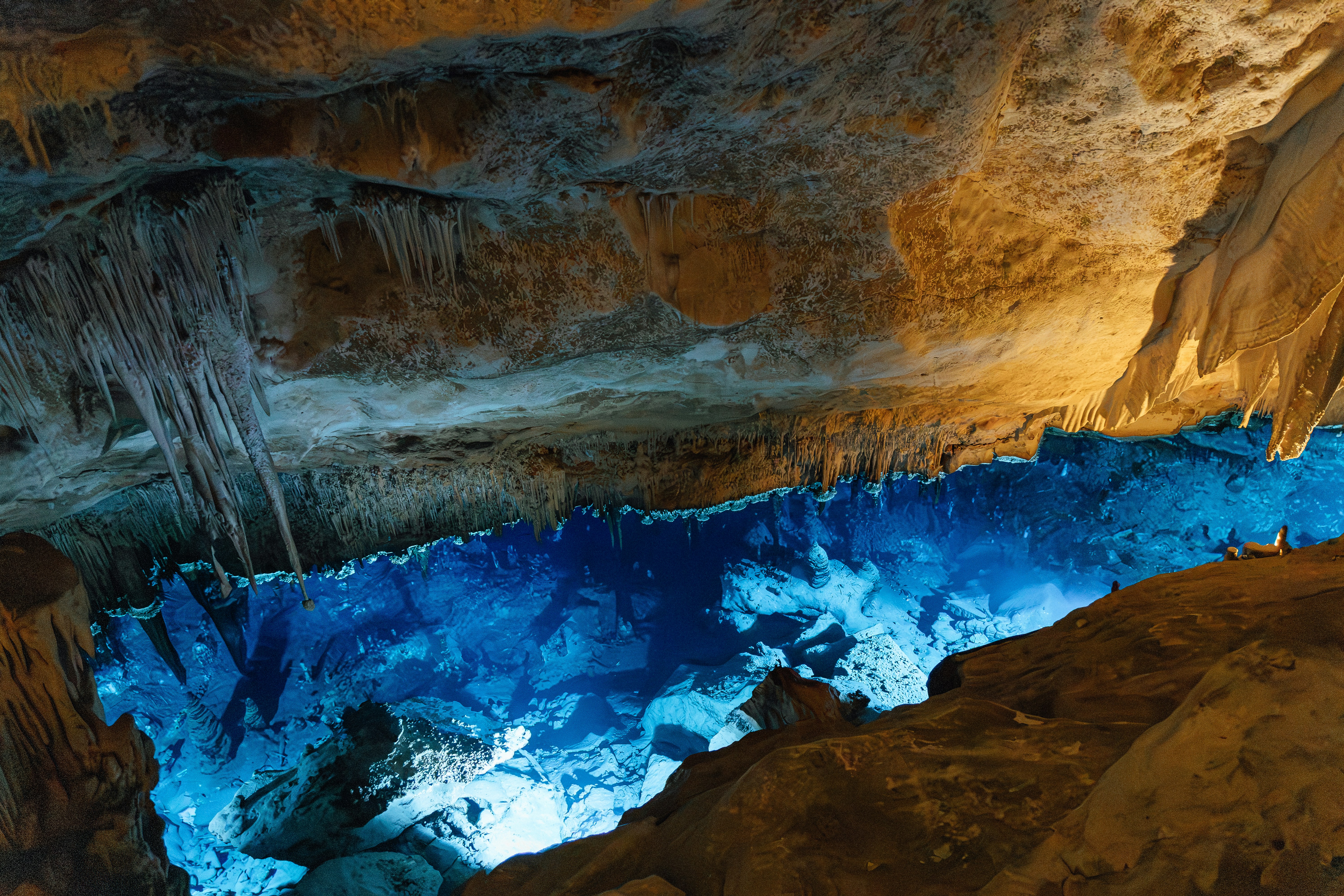 Glacier-blue Abyss: Icicle Phantoms over a Cavern's Edge