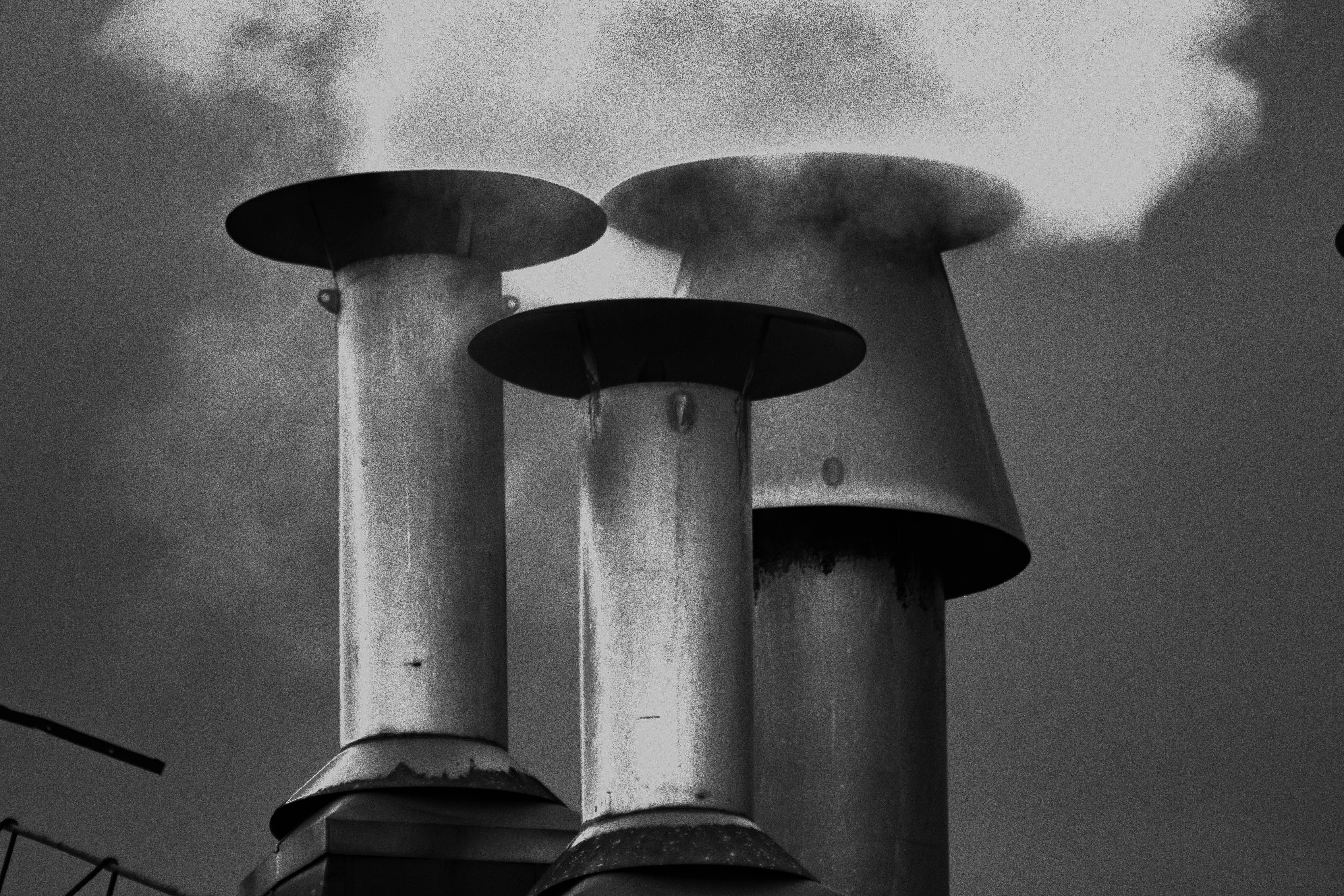 Industrial Silence: Steam Stacks Clad in Shadow