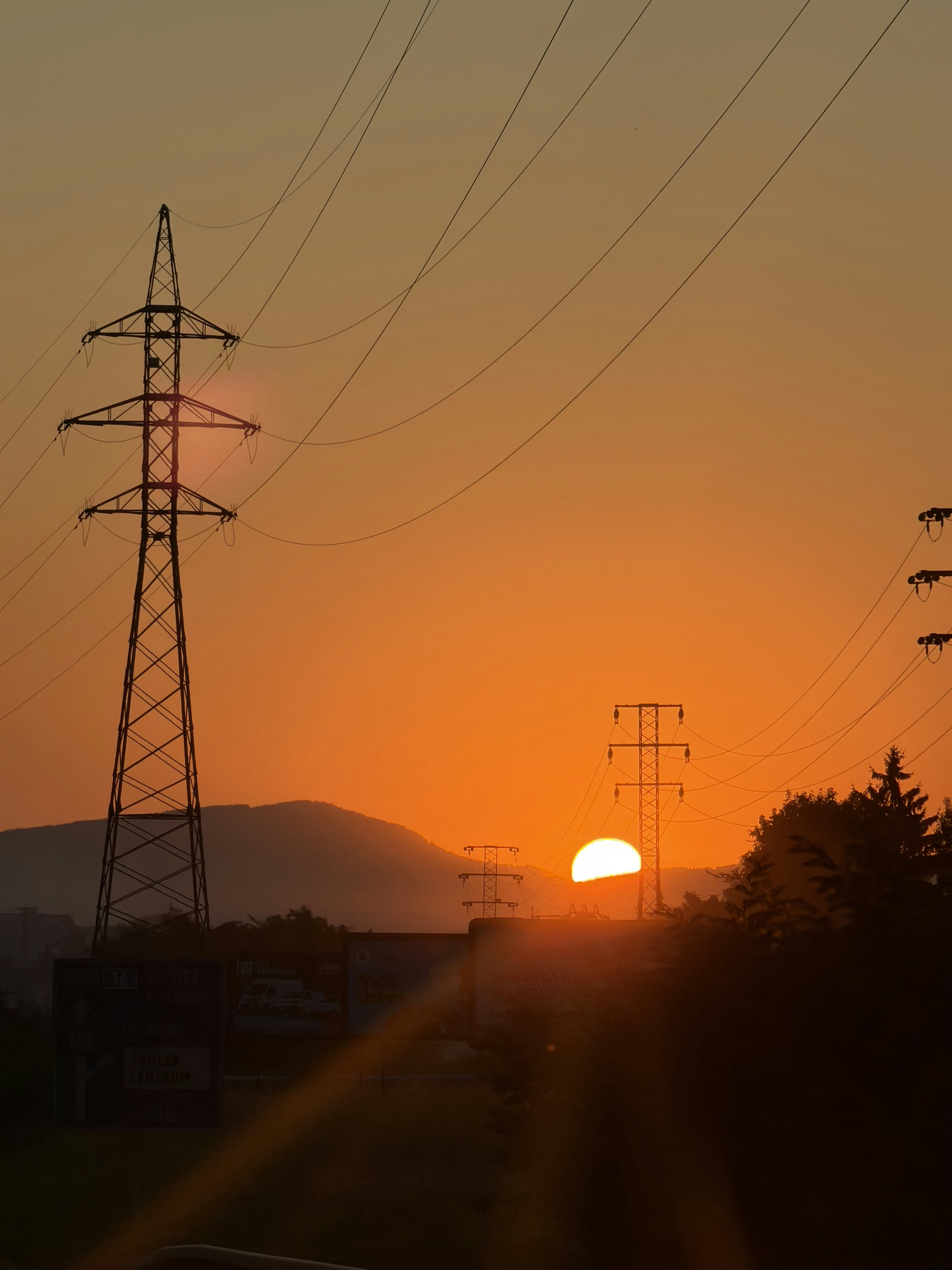 Sunset over Transmission Lines: A Calm Descent into Golden Silence