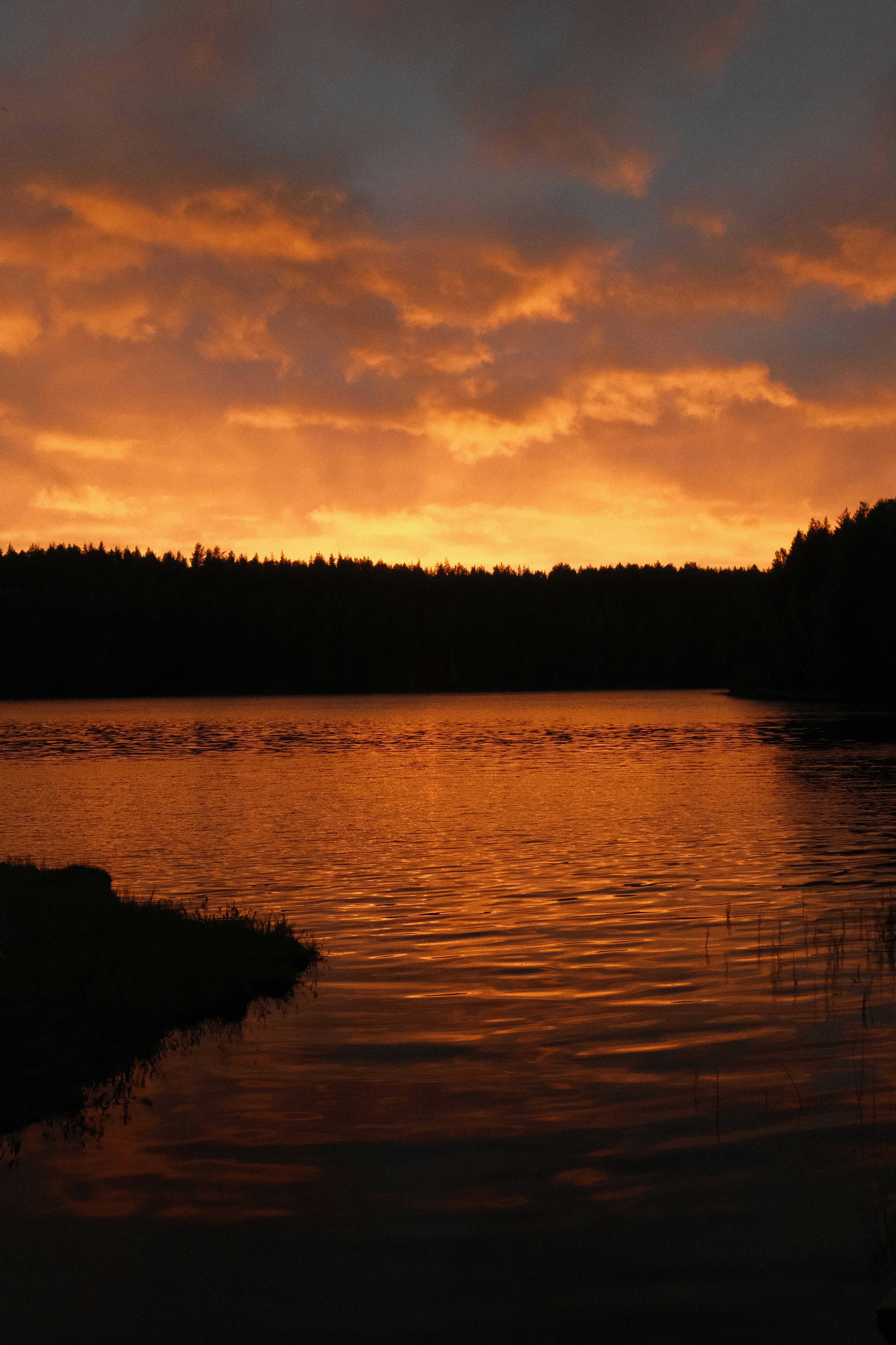 Glowing Horizon over a Quiet Lake at Sunset
