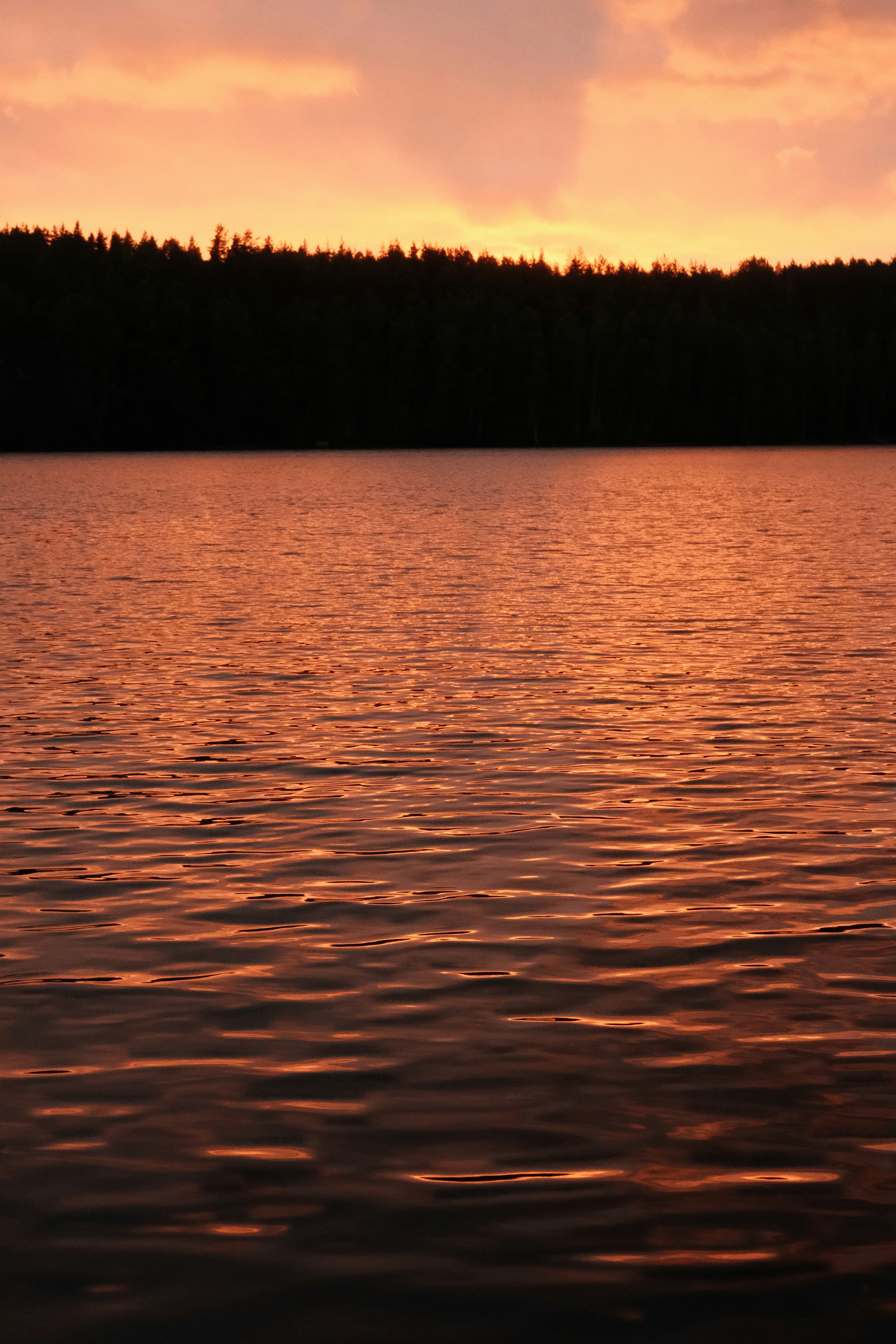 Amber Horizon Over Quiet Lake at Sunset