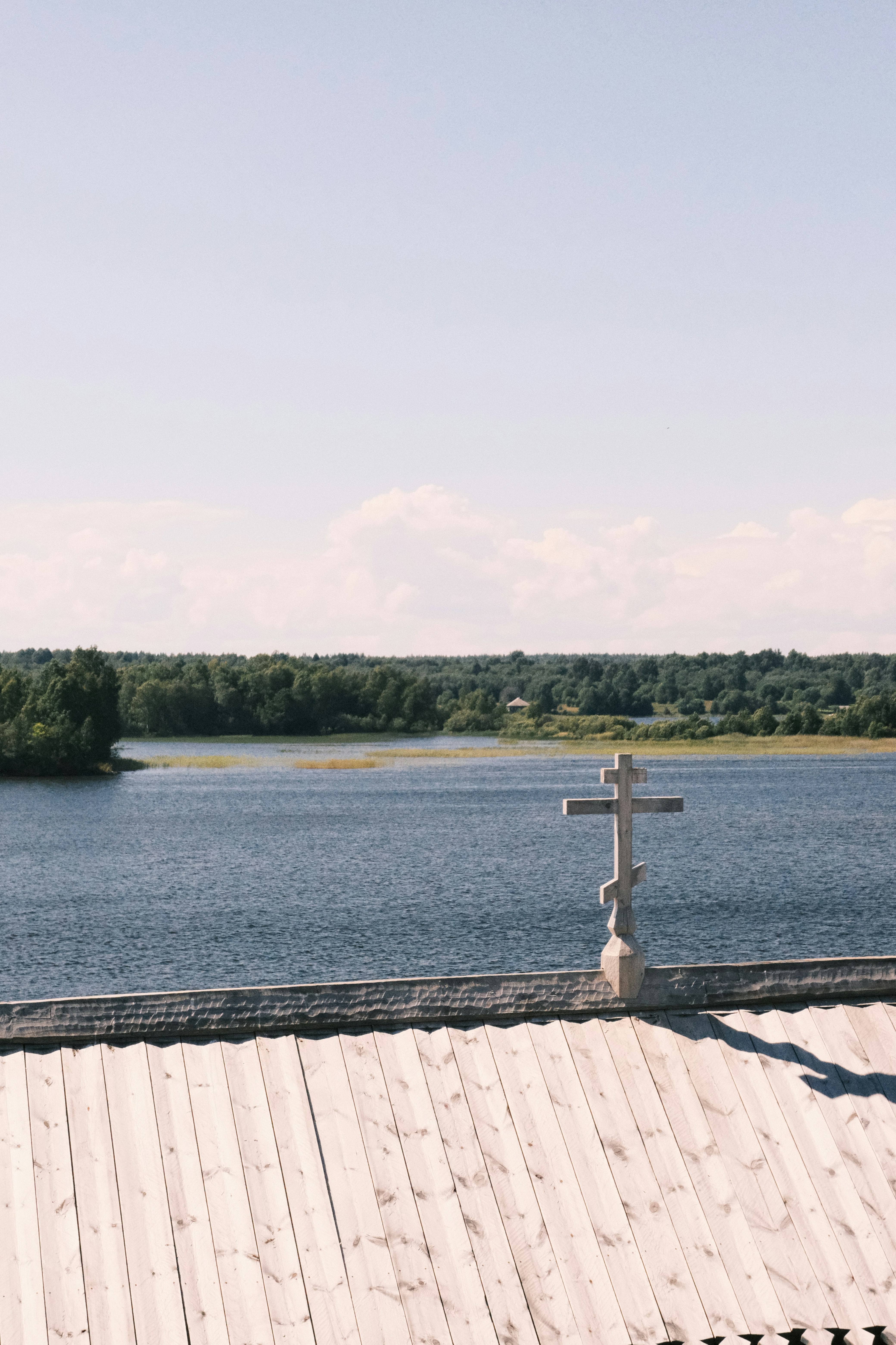 Crossing the Quiet Horizon: A Roof, a Sky, and a Distant Shore