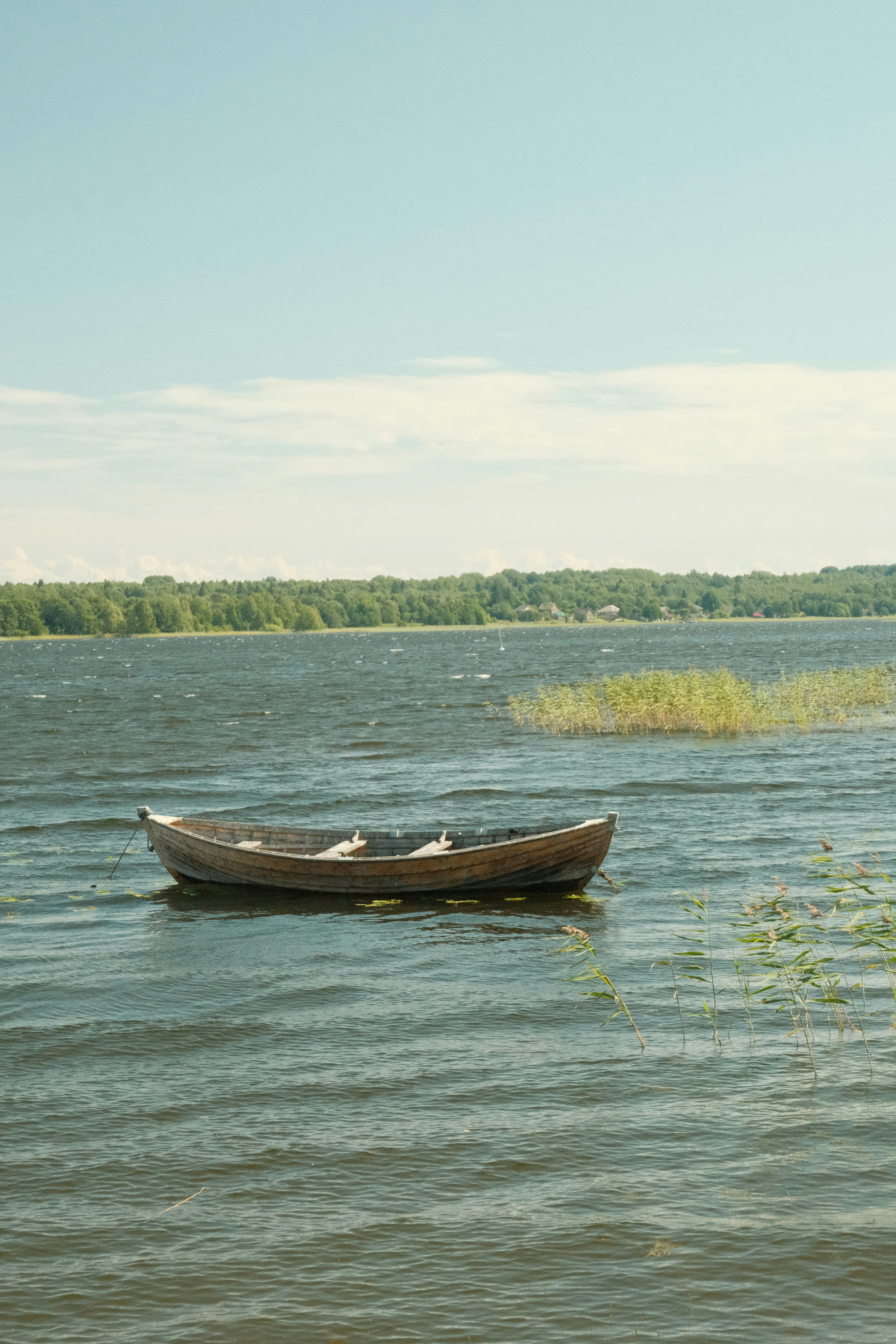 Solitary Boat Adrift on A Quiet Lake