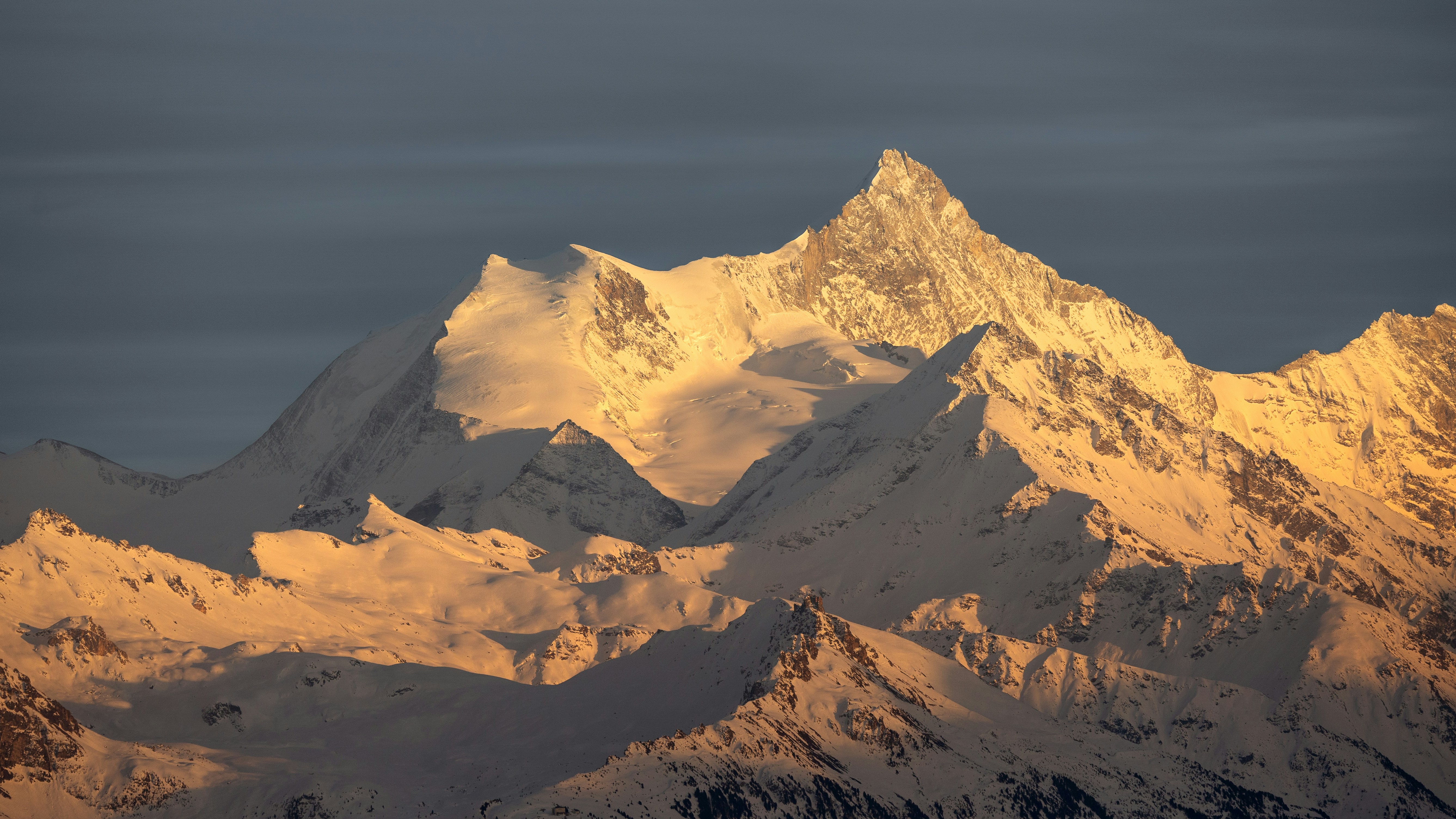 Alpenglow Crown: Summit in Golden Light