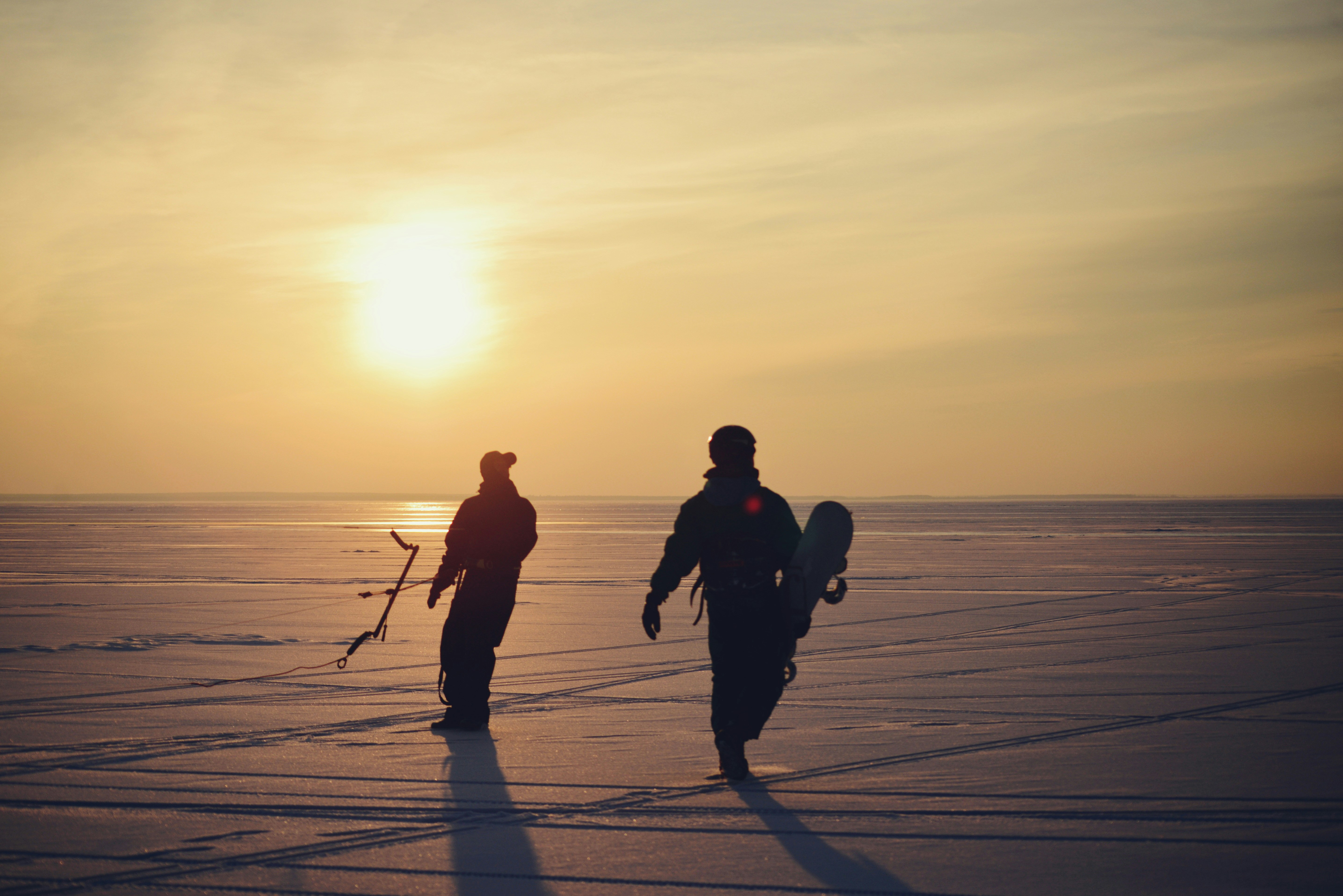 Silhouettes with Snow-Glittered Horizon at Sunset