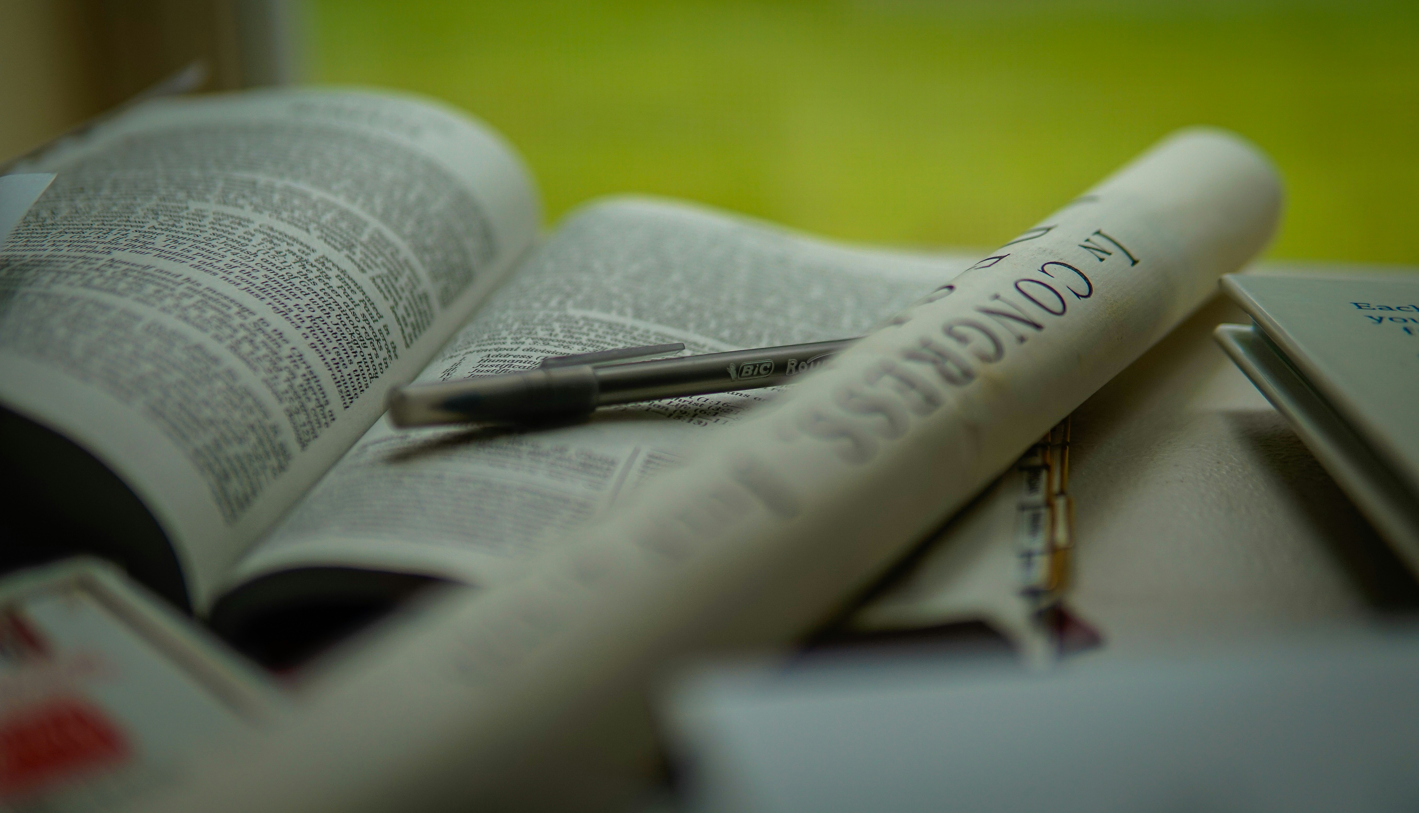 Underscored Headlines: A Quiet Desk of Newsprint and Pen