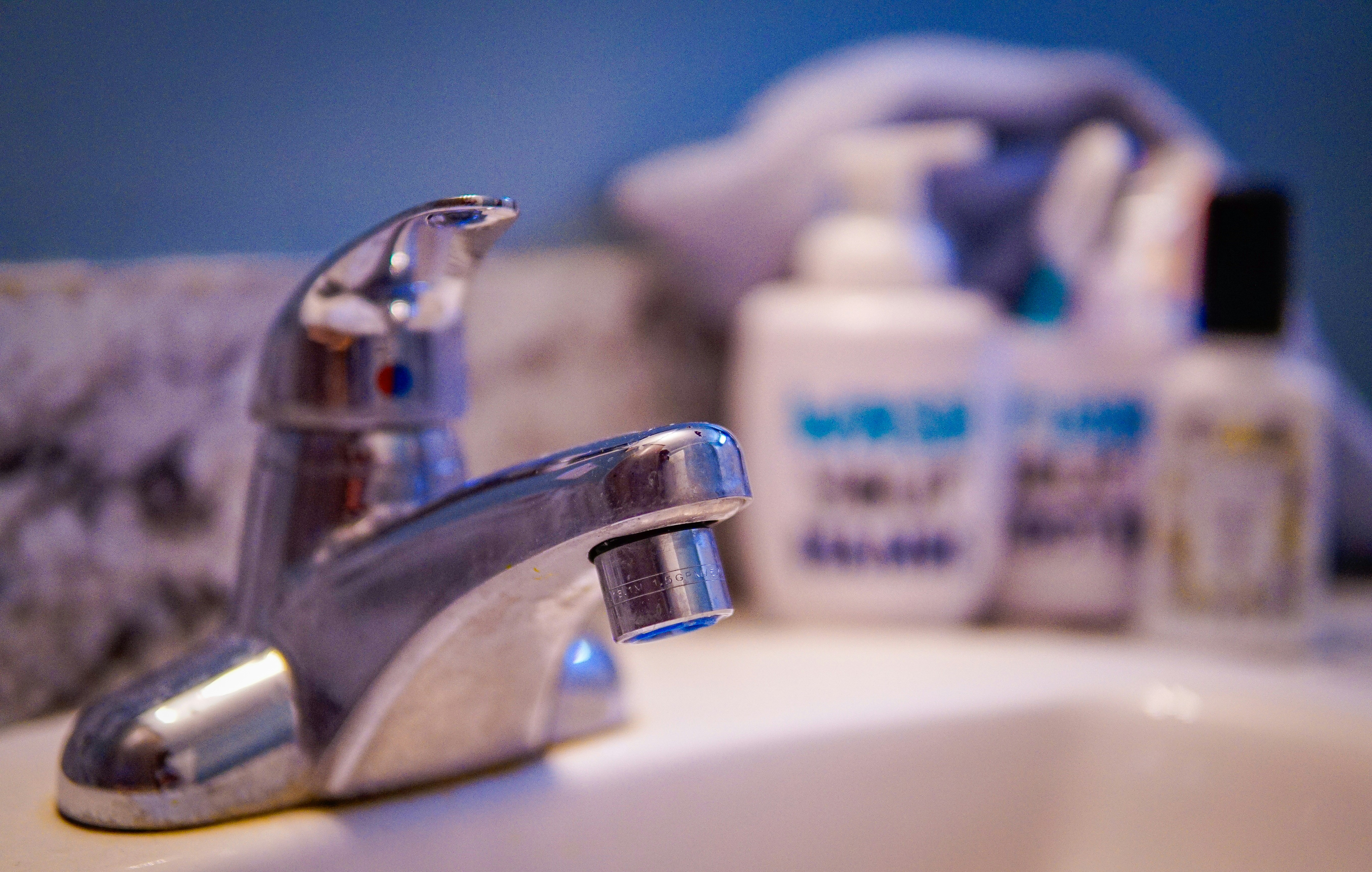 Chrome Faucet in Focus: Subtle Blur of Bathroom Essentials
