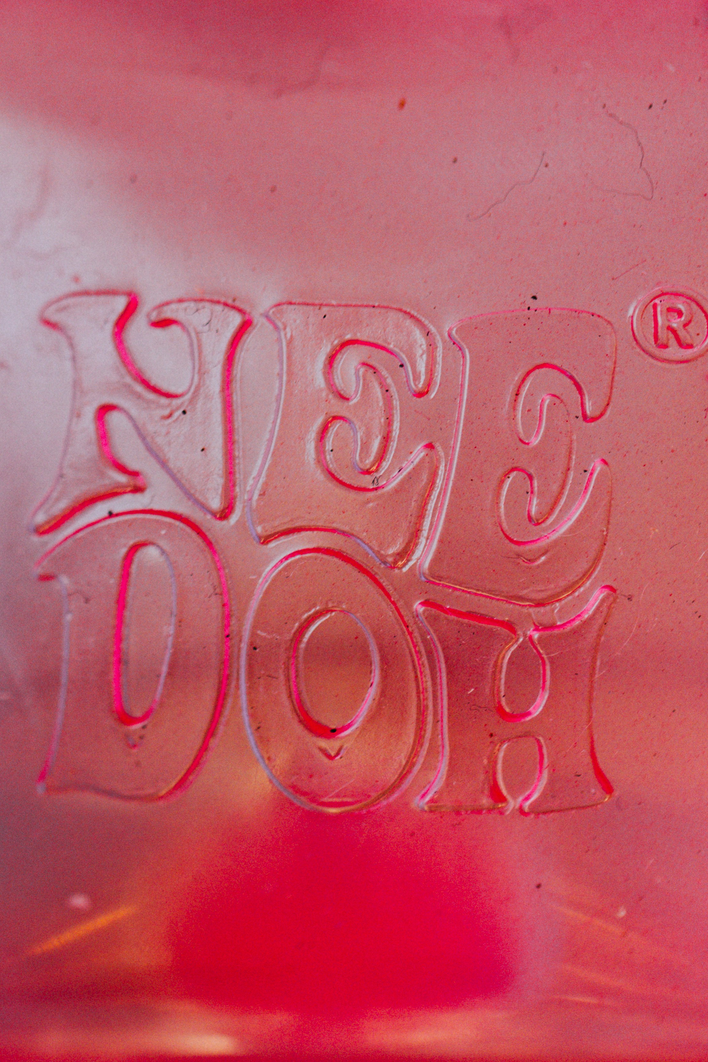 Neon-Pink Coca-Cola Glass Texture with Recessed Branding
