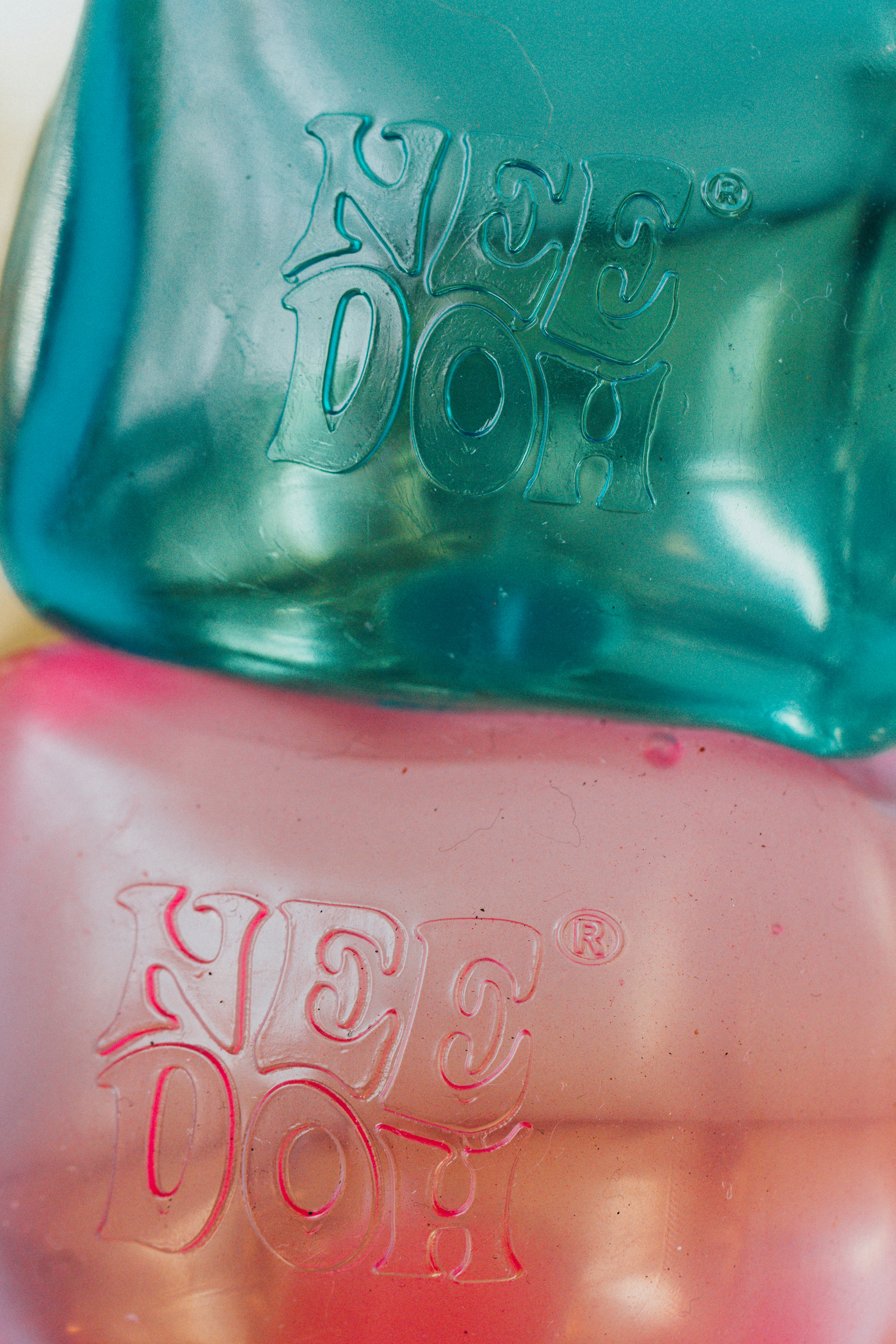 Two-Tone Gummies: Neon Bottles in Soft Focus