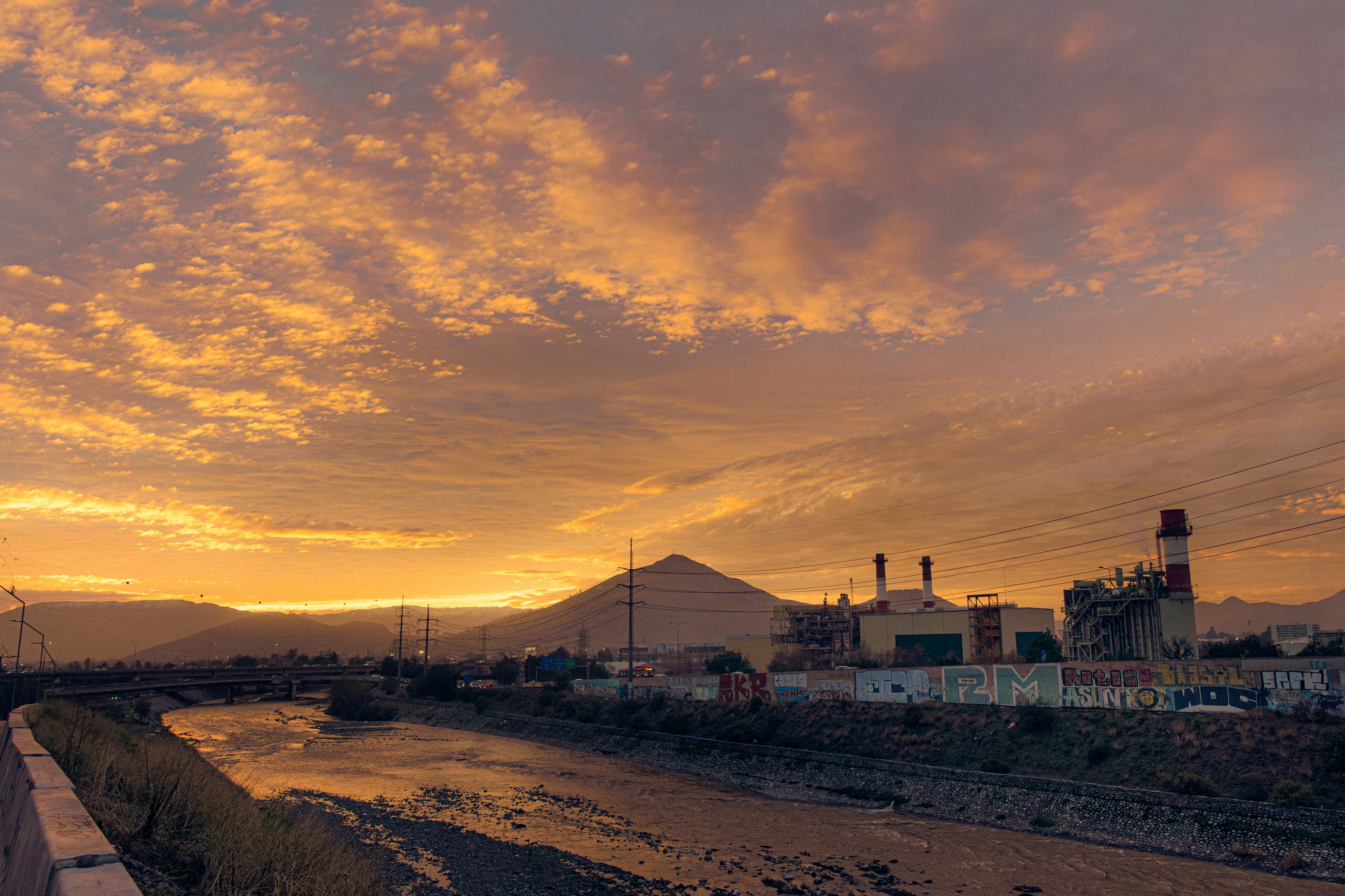 Sunset Over a Riverfront Industrial Canvas