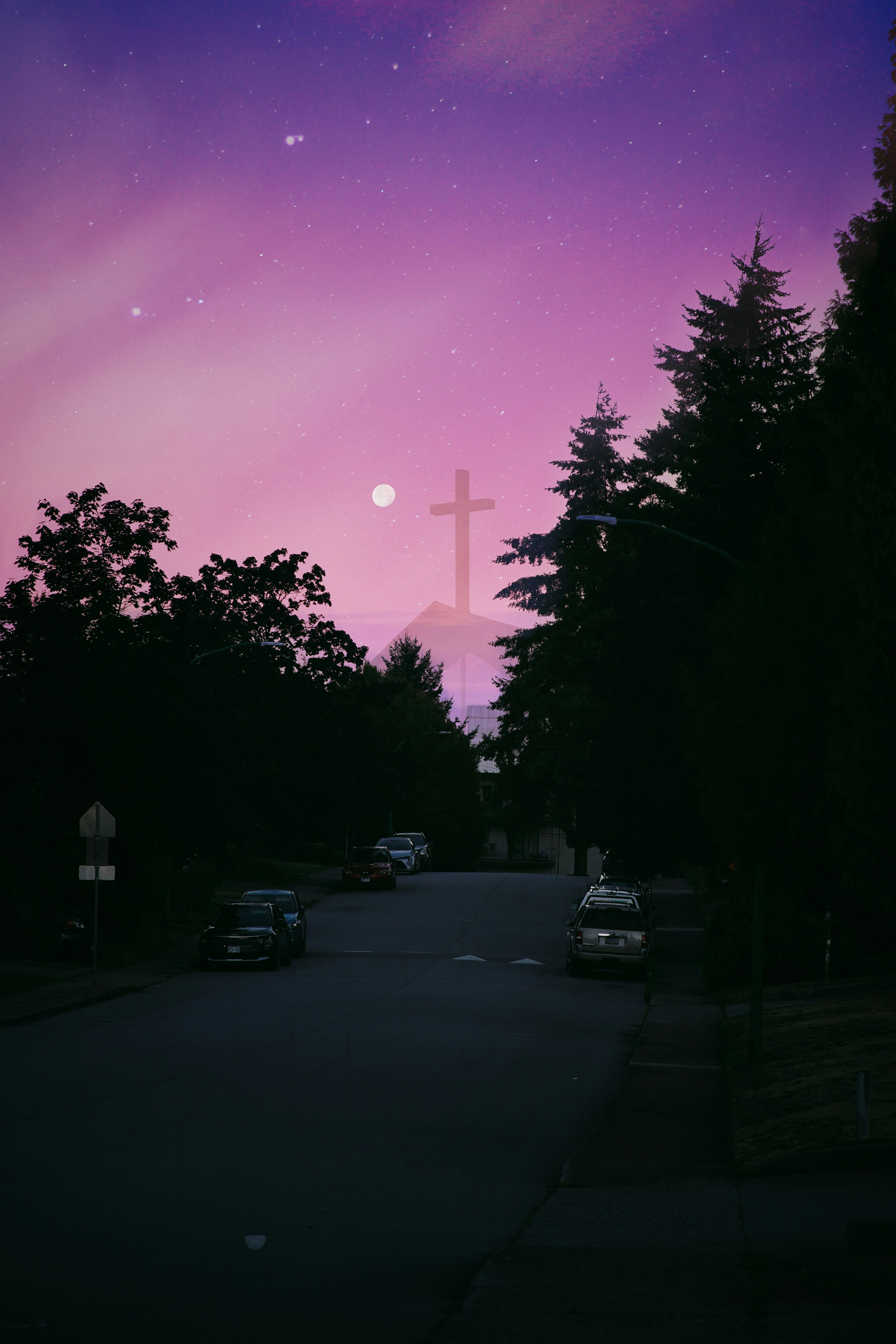 Moonlit Cross: A Quiet Street Leading Toward the Sacred Silhouette