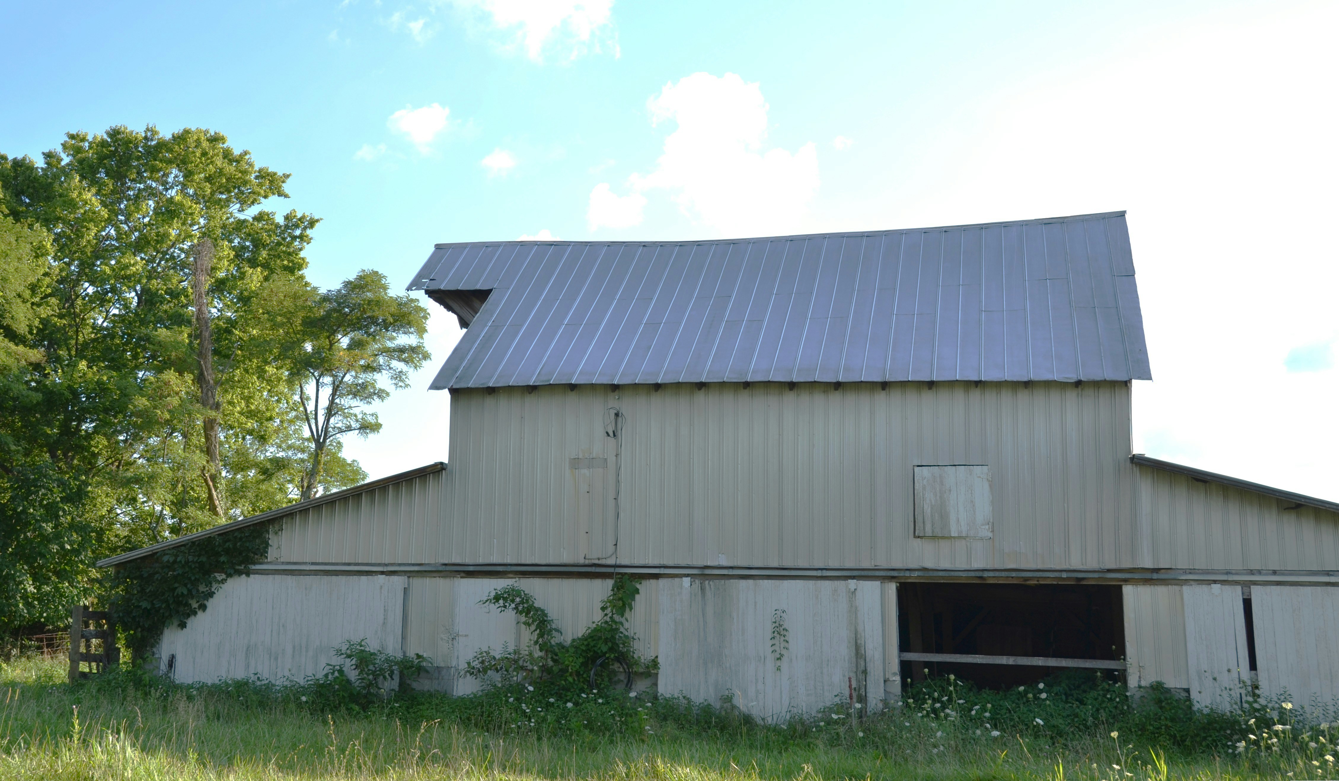 Barn Silhouette Under Bright Sky