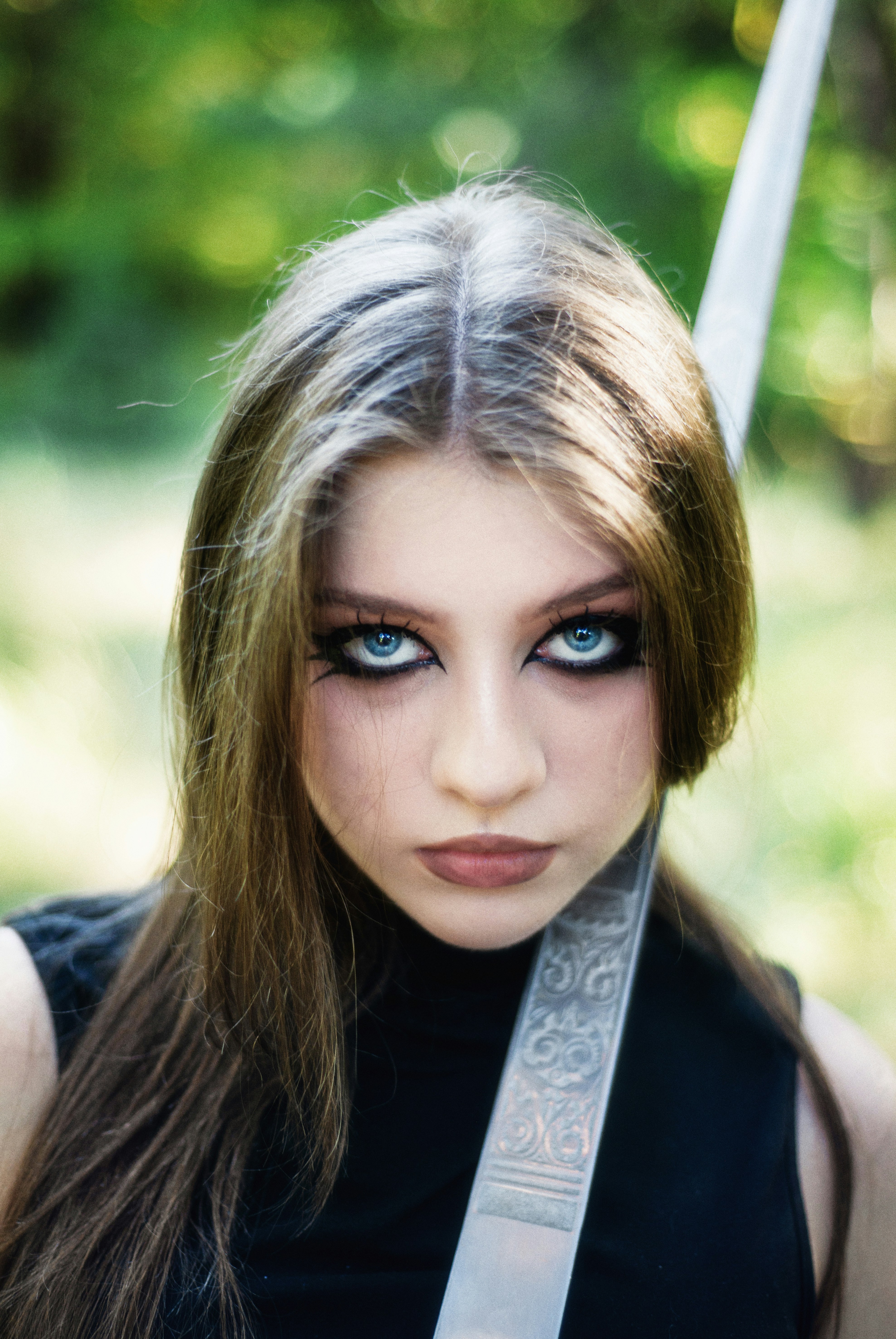 Gaze Through the Blade: Intense Portrait in Soft Backlight