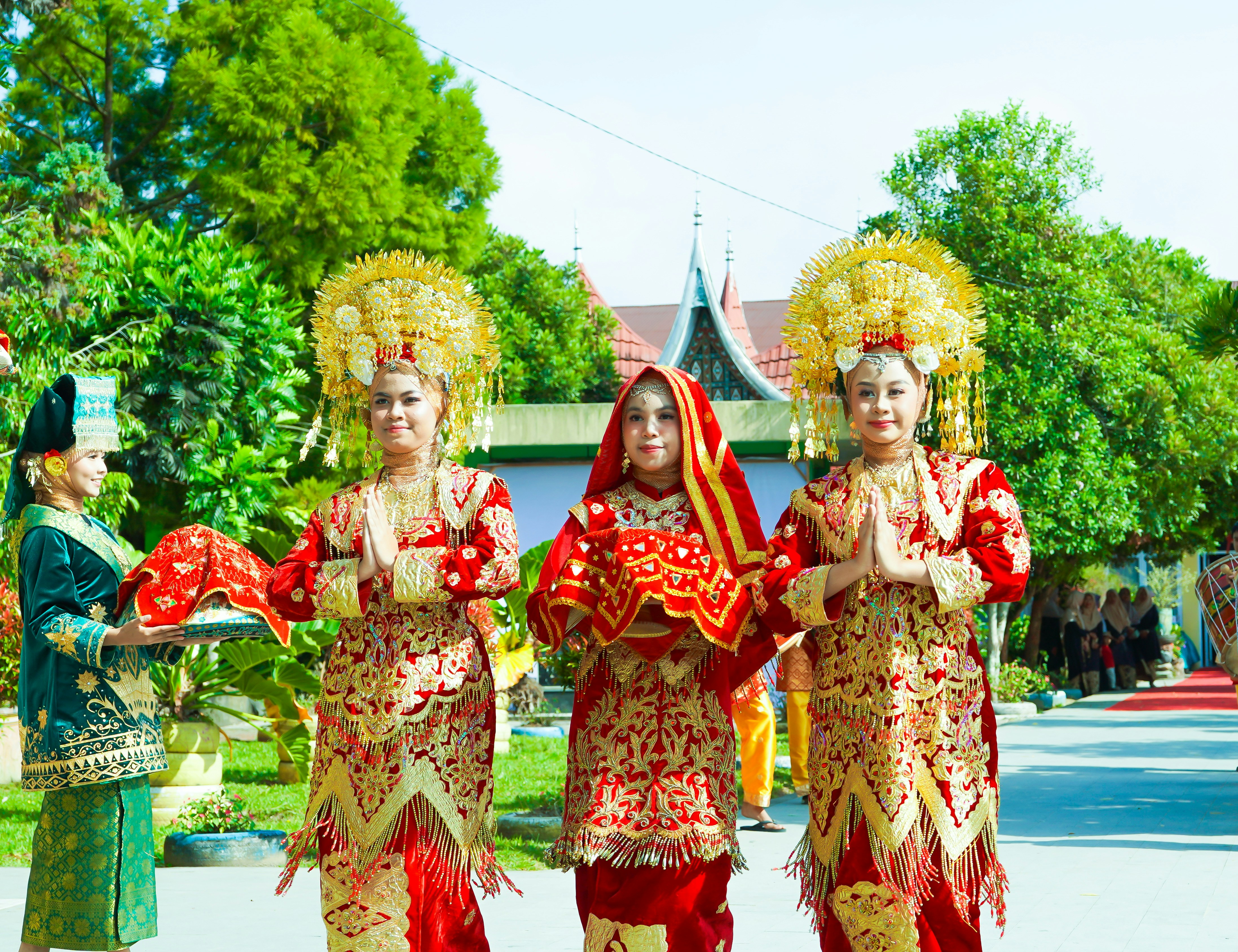 Regal Festival Dancers in Golden Attire Under Sunny Arcadia