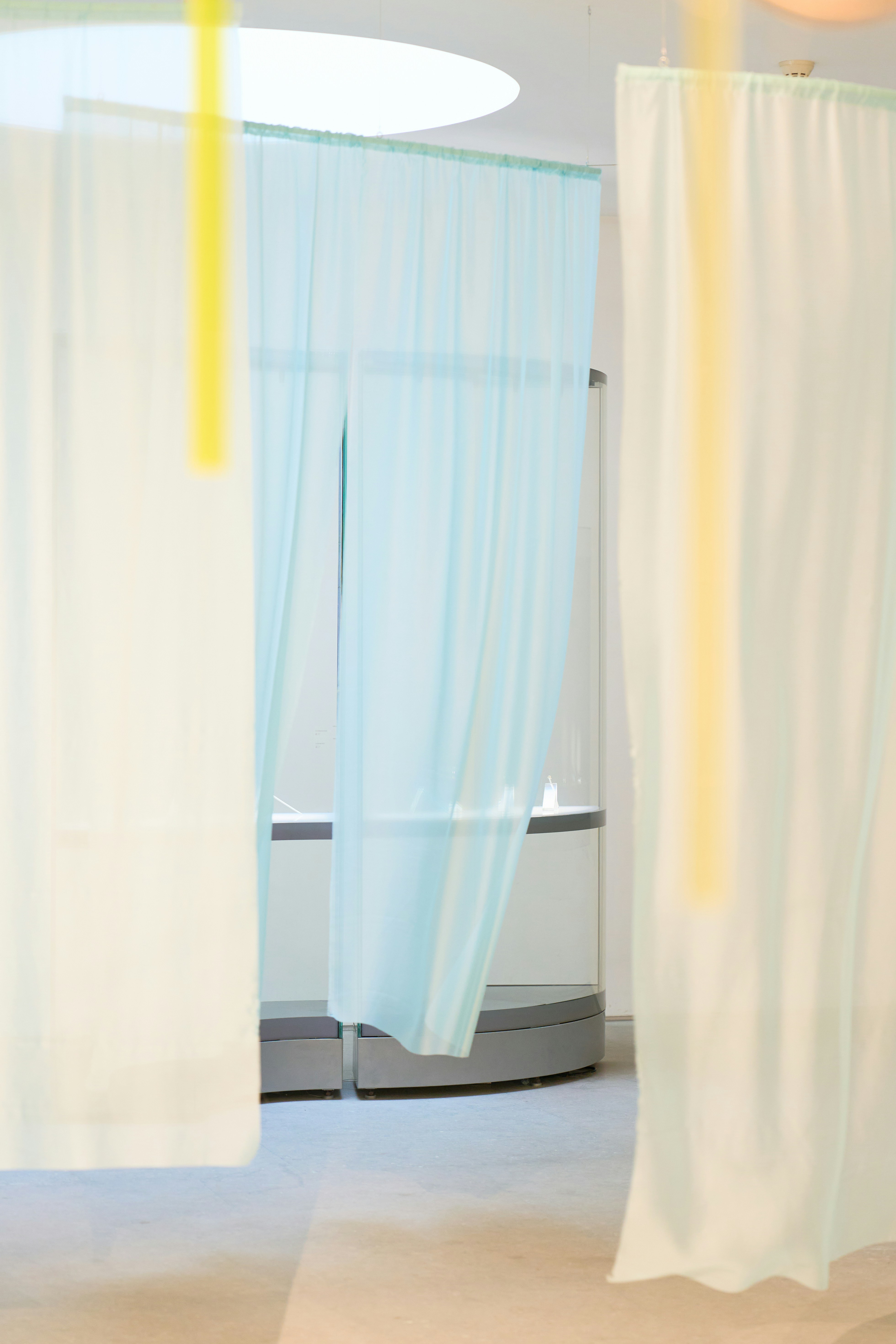 Soft Curtains and Subtle Colors: A Gentle Gallery Corridor