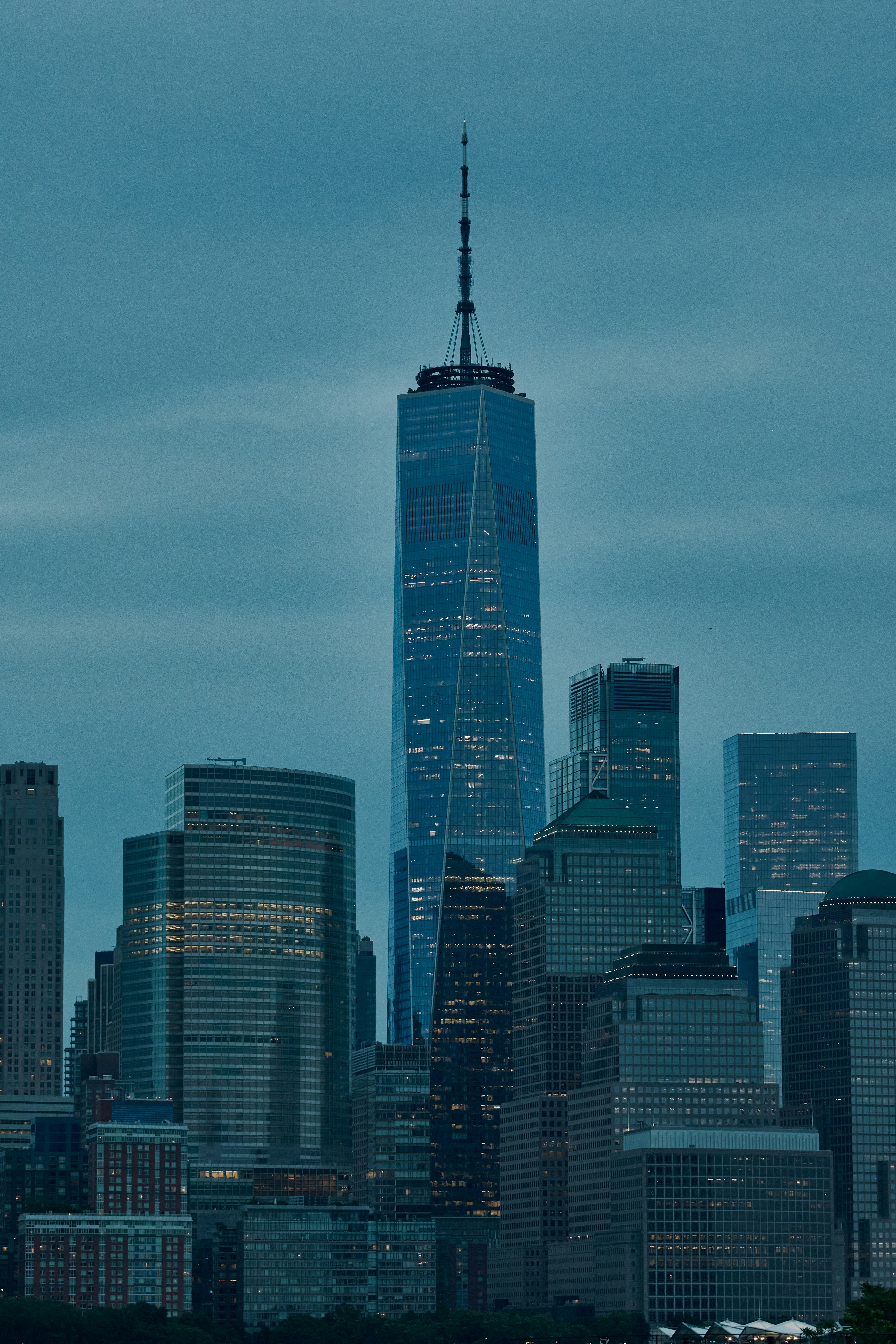 Skyline Crown: One World Tower Rising Above the River of Glass