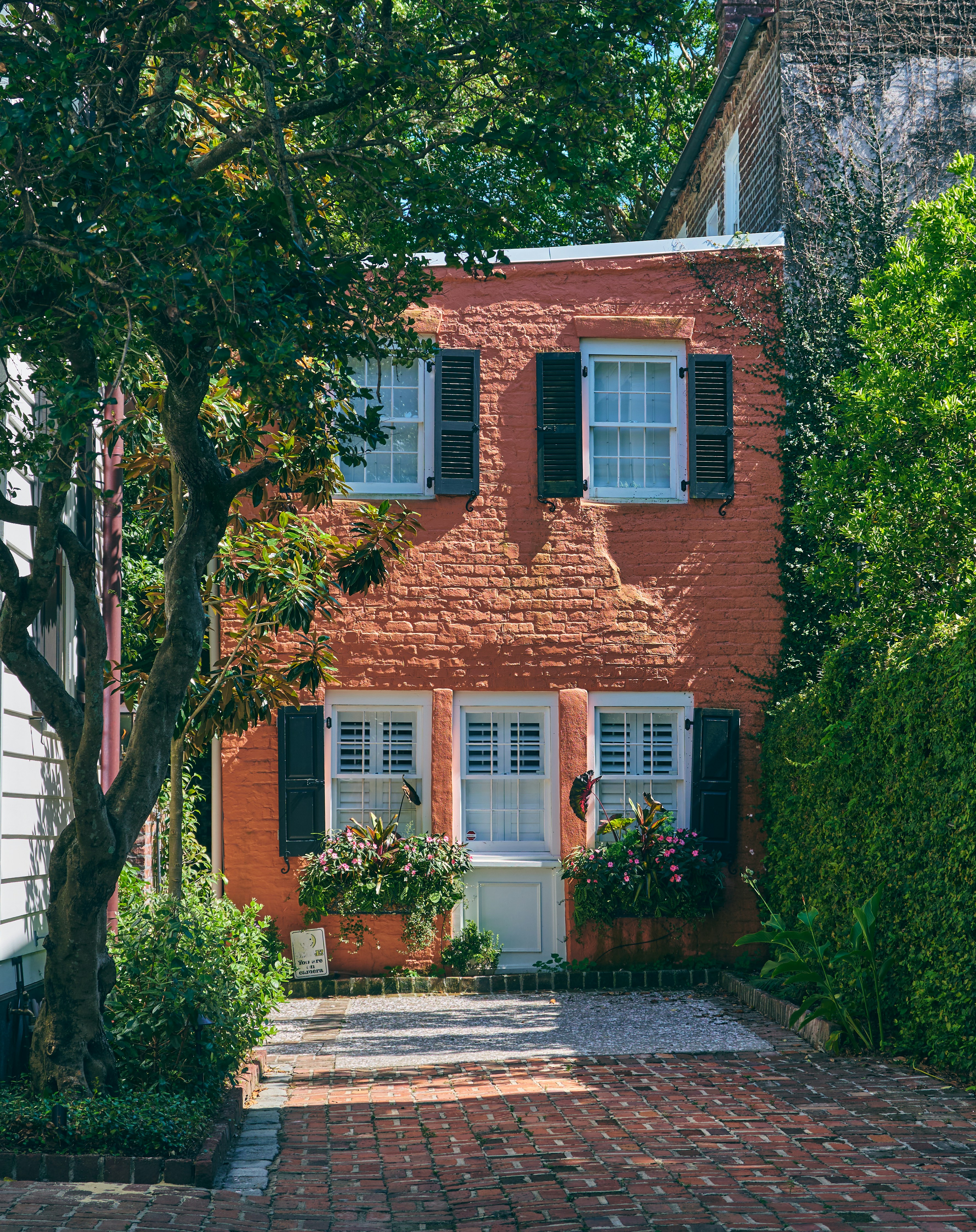 Brick-Faced Cottage in a Green Courtyard