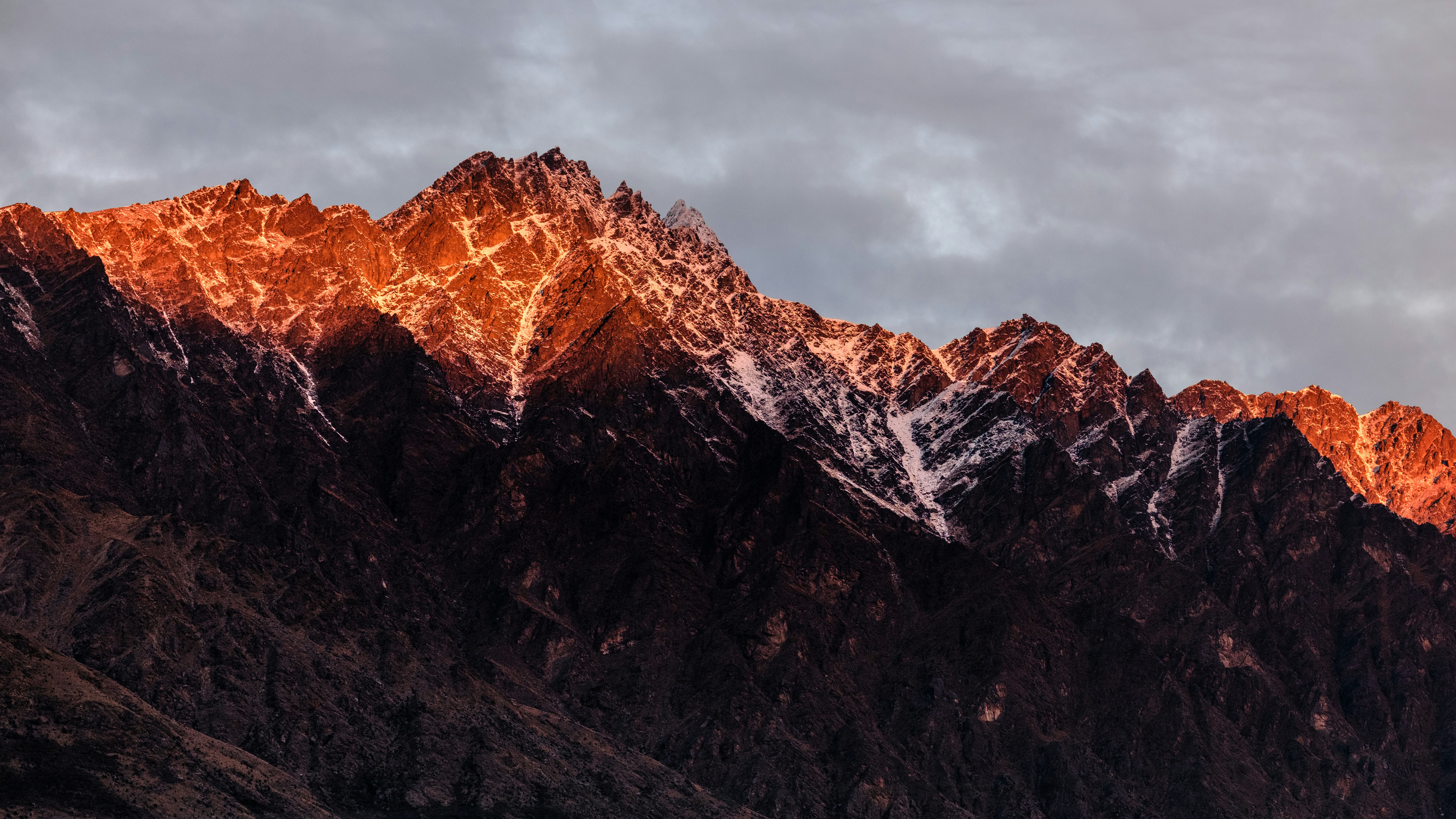 Crest of Fire: Alpine Peak Bathes in Alpenglow