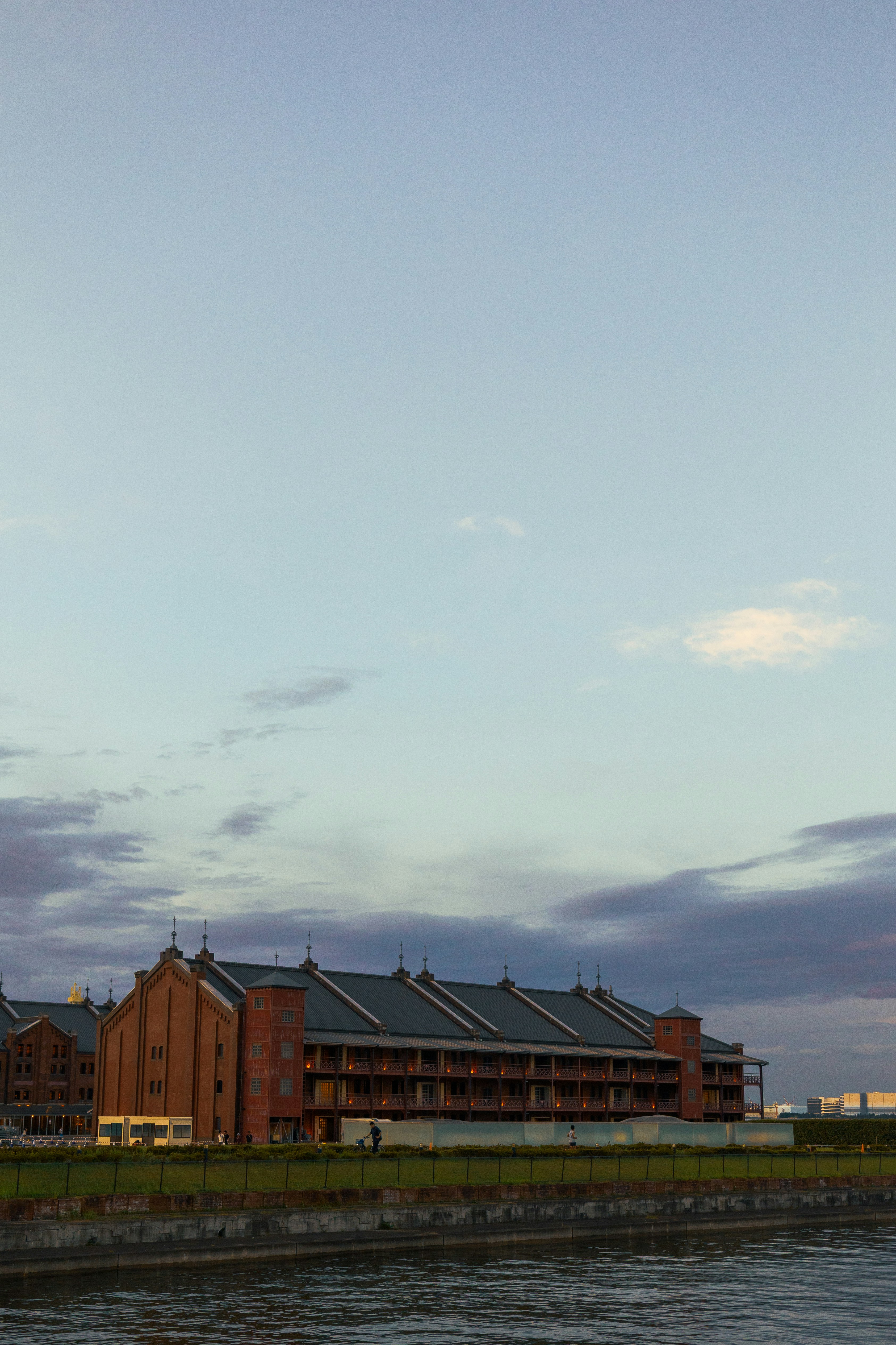 Brick Warehouse by the Water: Evening Light on a Waterfront Row