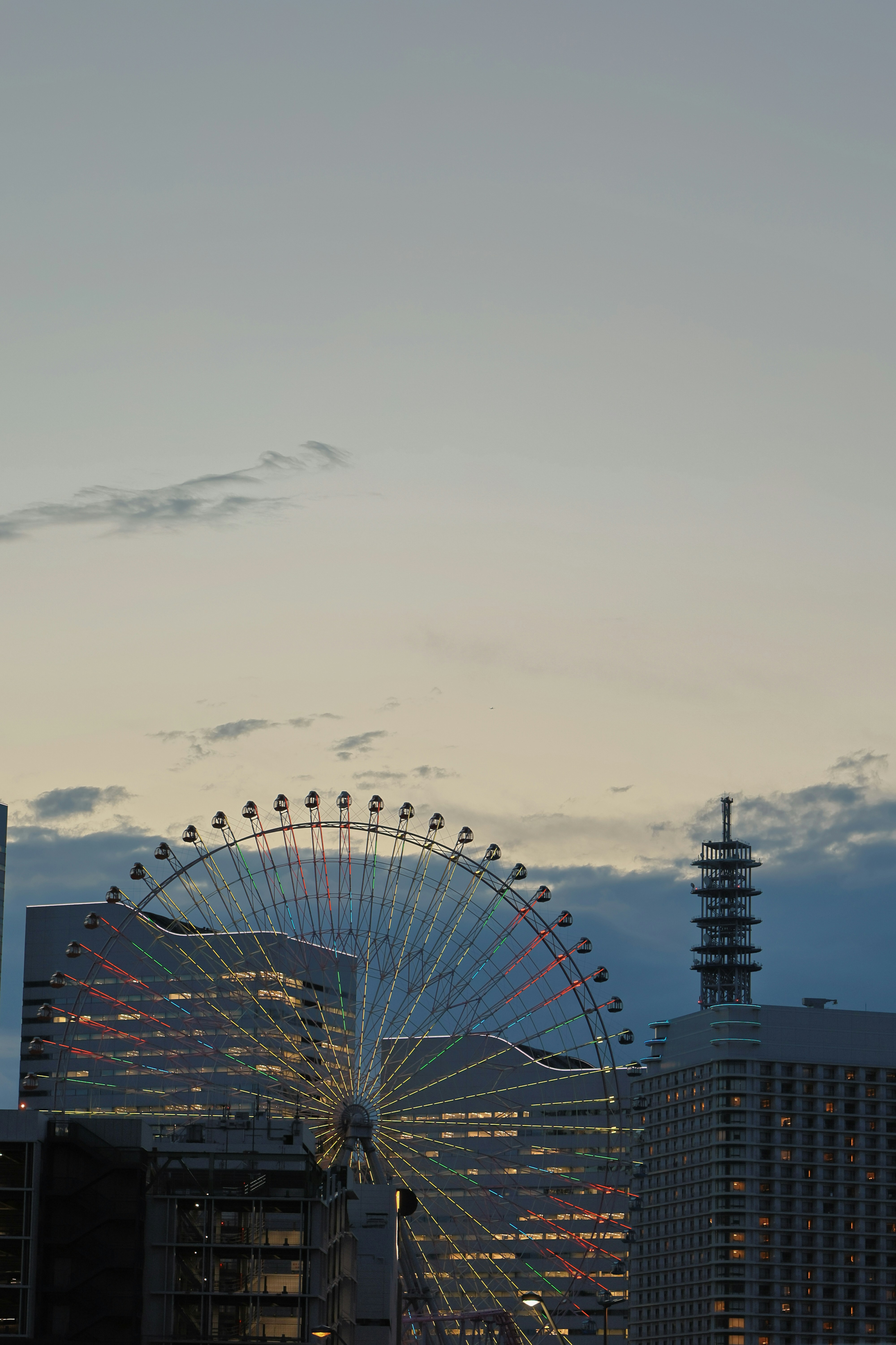 Dawn Over The City Wheel: Neon Arcs Meet Sky Colors