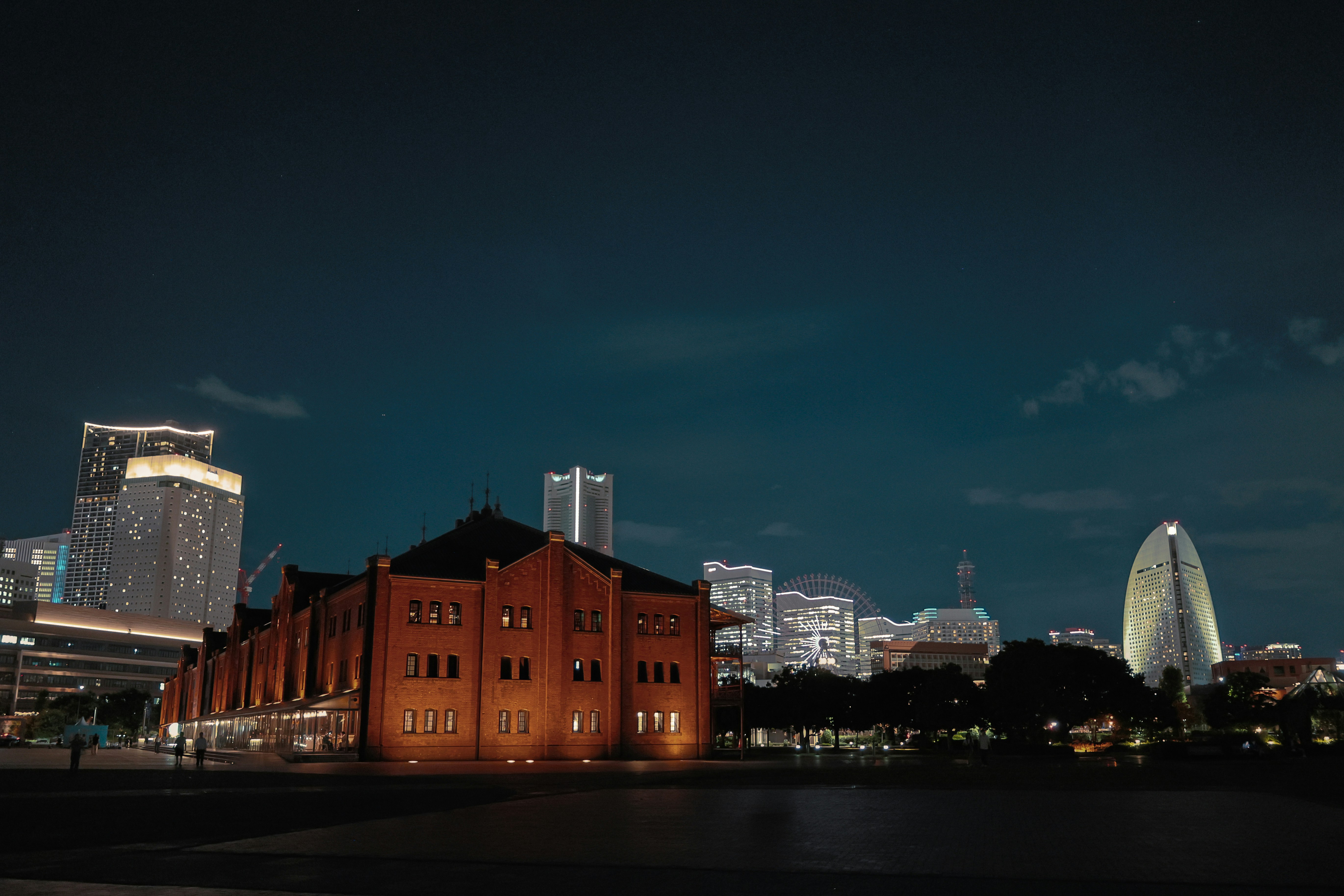 Brick Warehouse by the Waterfront Under Neon Sky
