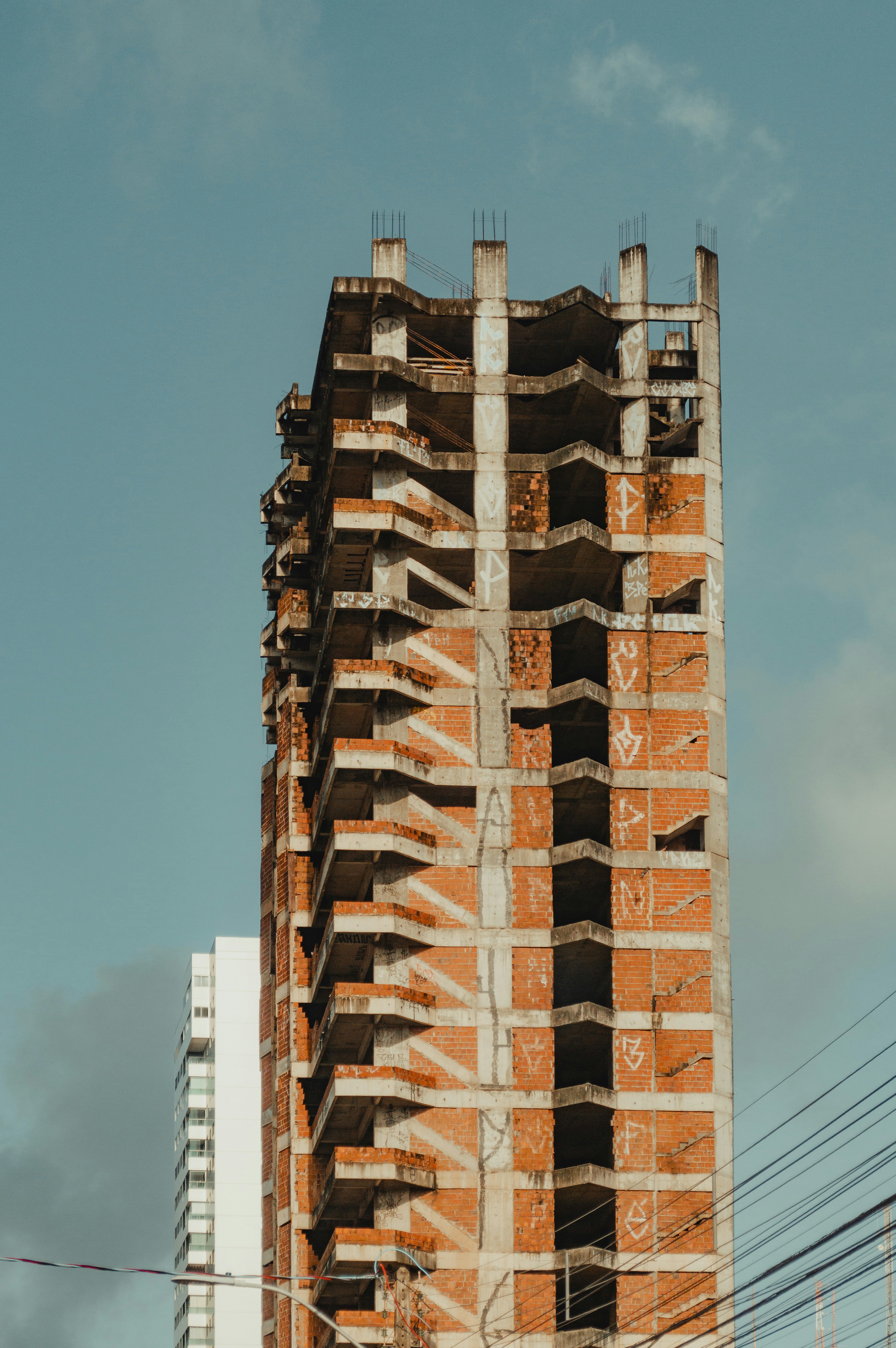 Stacked Echoes: The Brick Skeleton Reaches for the Sky