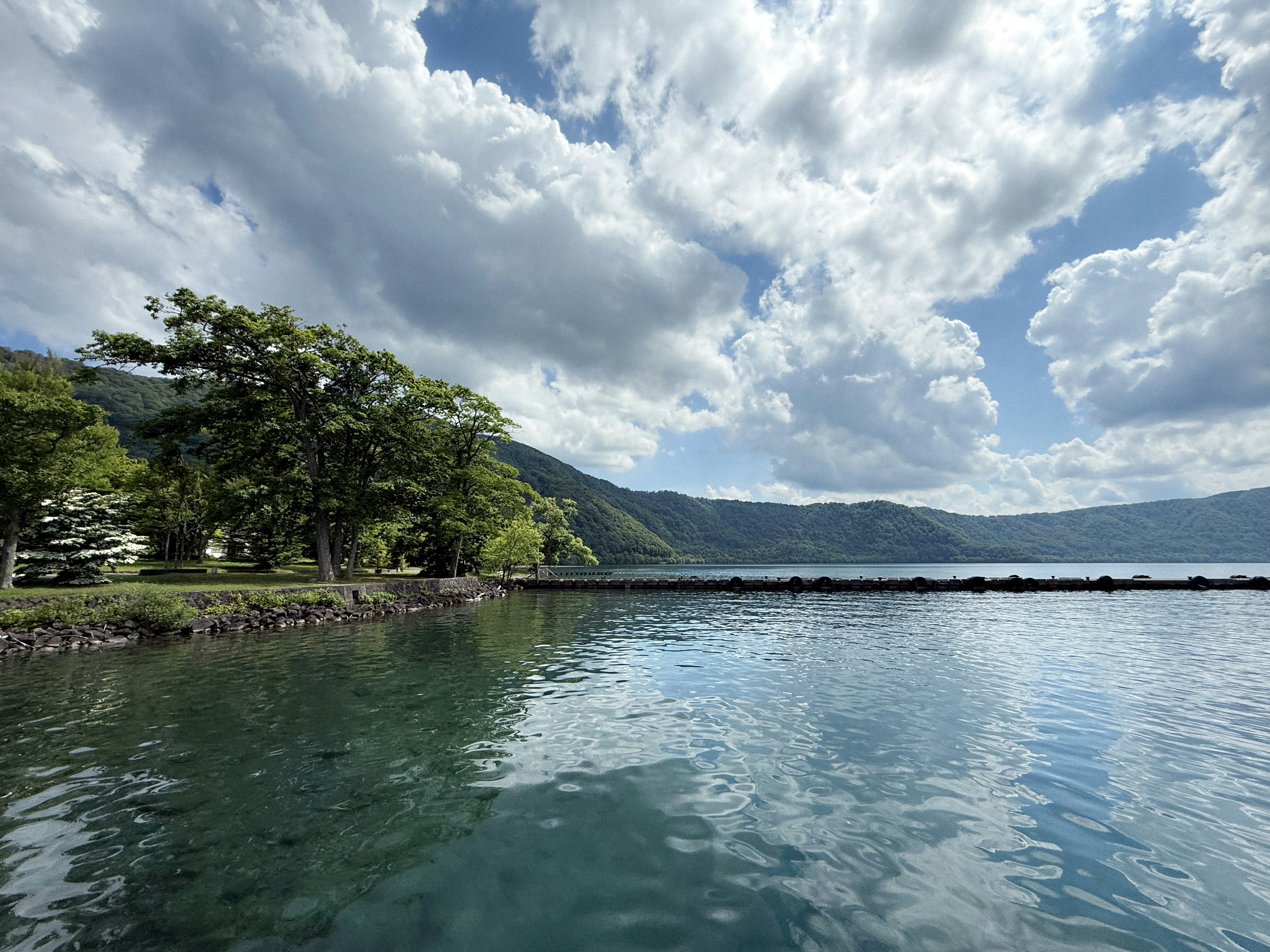 Lakeside Crest: A Quiet Panorama Beneath Cobalt Skies