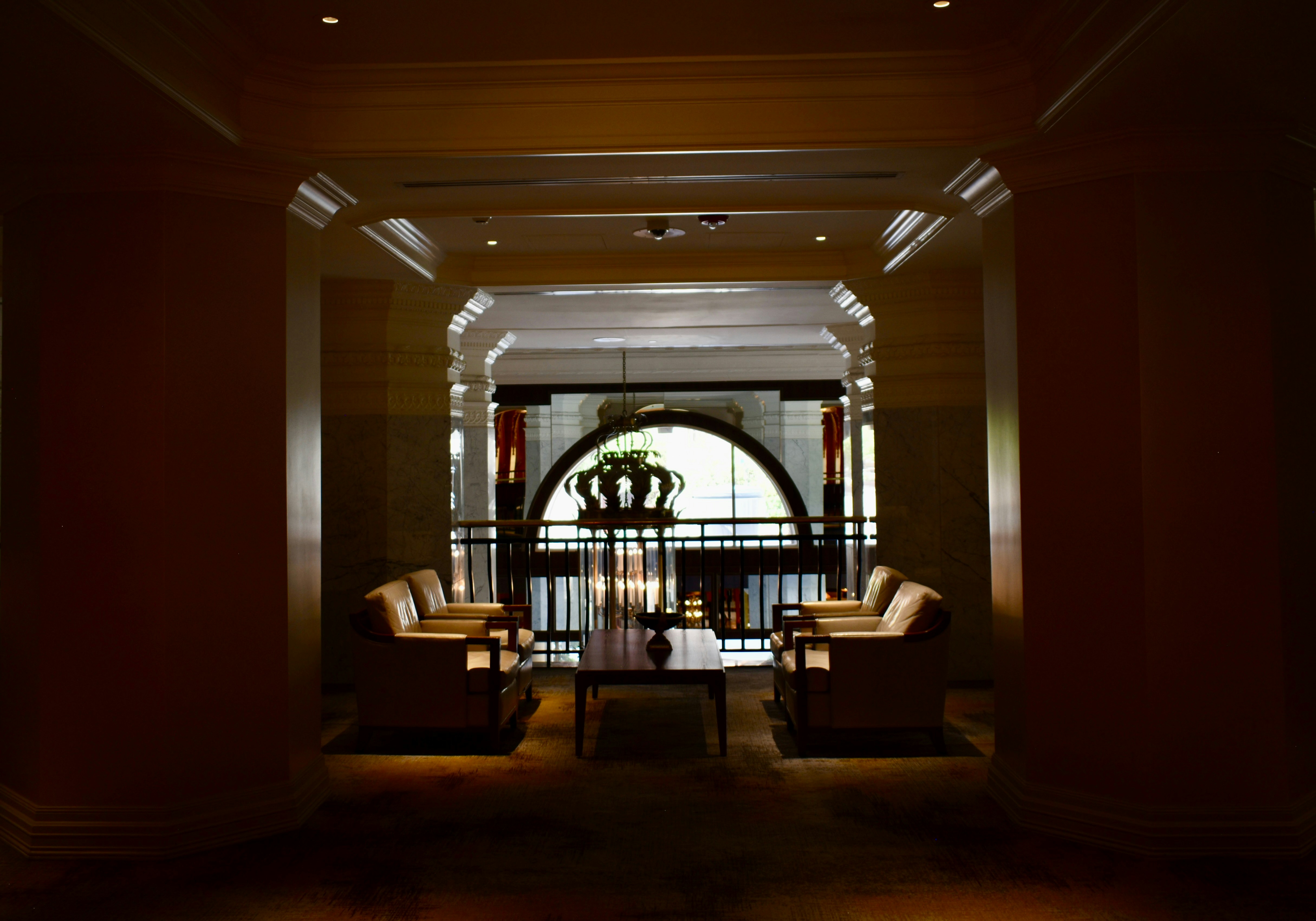Silhouette at the Atrium: A Quiet Lounge Beneath Arched Horizon