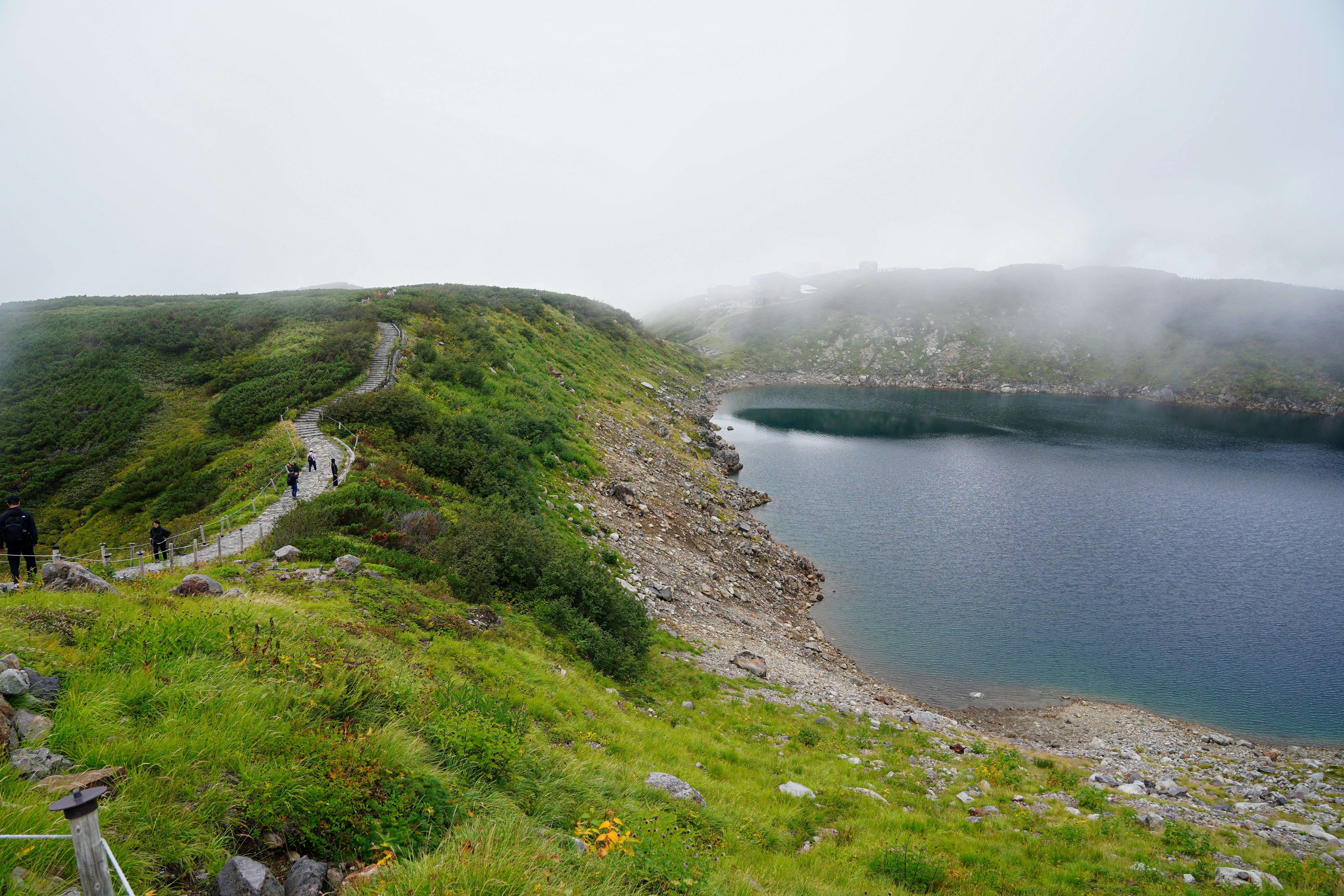 Looming Mist over the Ledge: A Highland Trail Toward the Silent Crater Lake