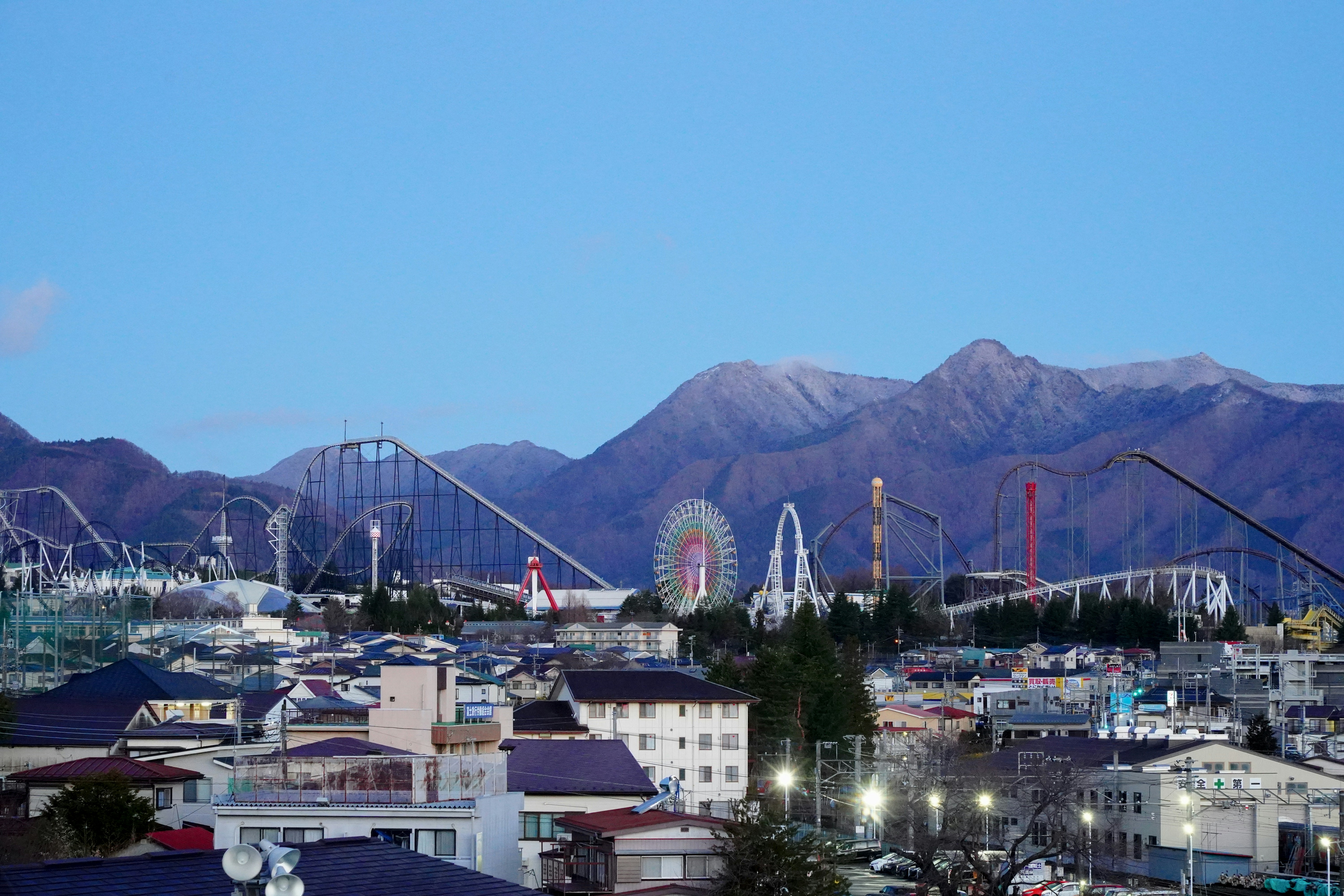 Urban Carnival Under a Mountain Skyline