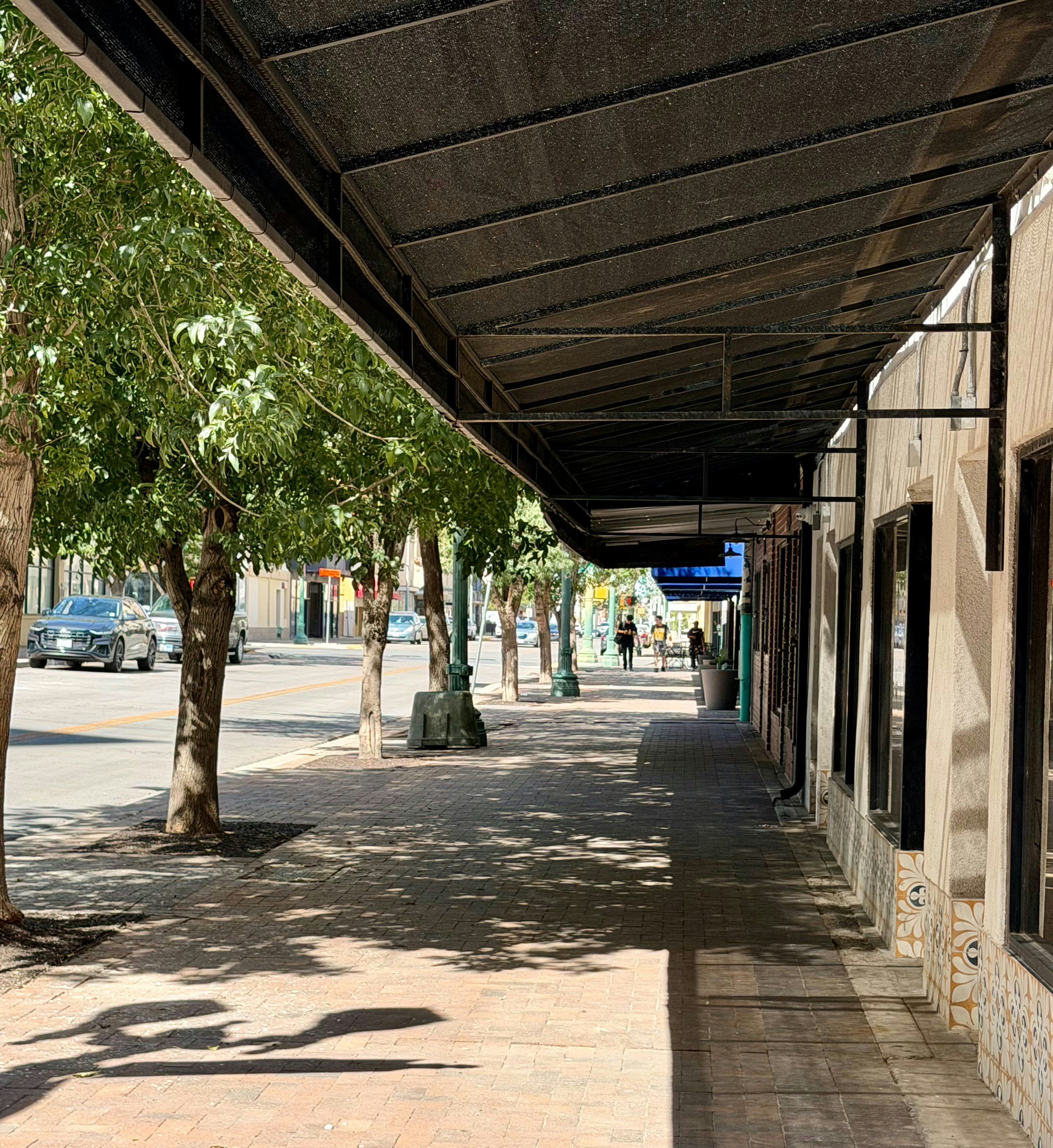 Shaded Arcade Opens to Sunlit Street