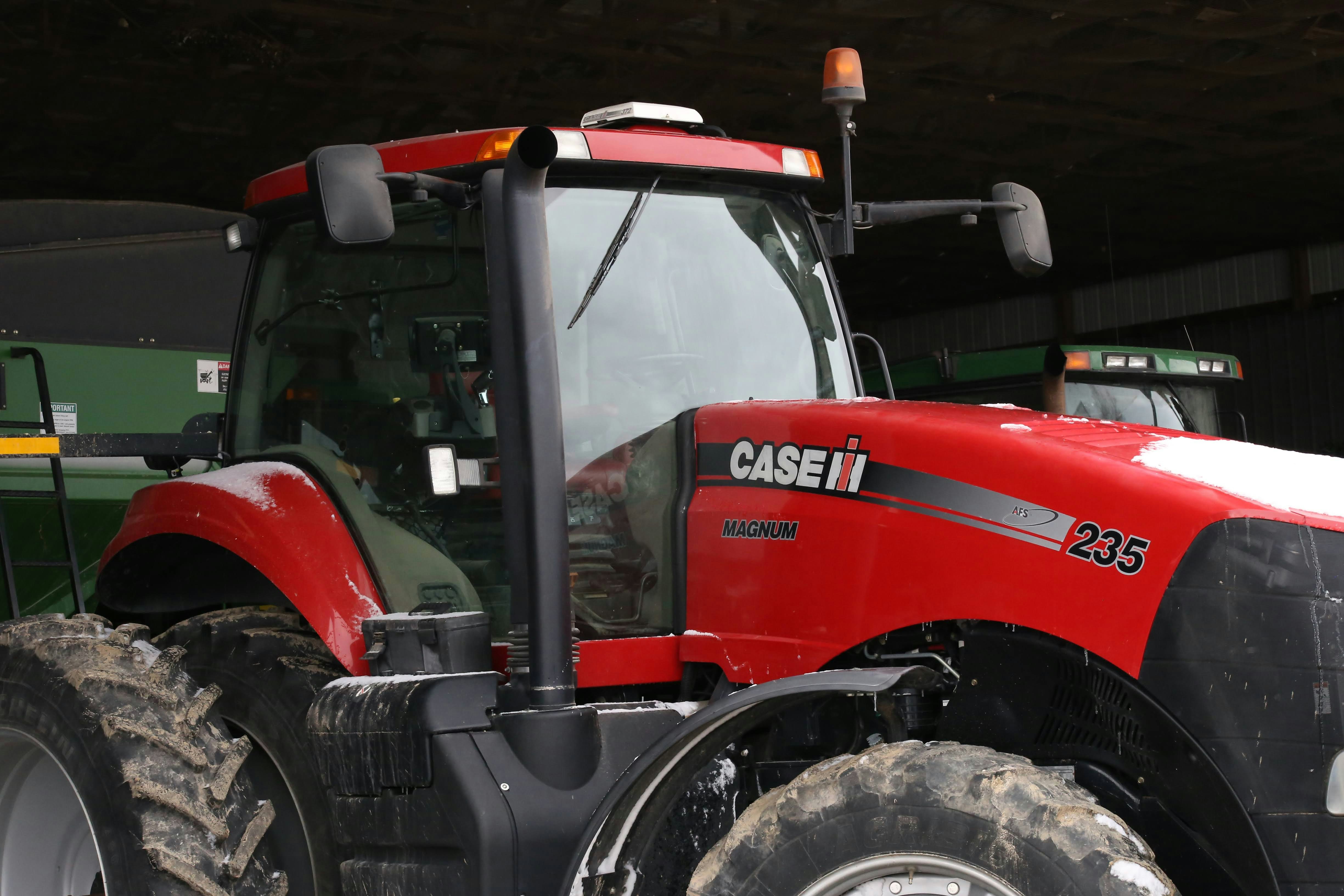 Red Magnum: The Case IH Tractor Under Industrial Shade