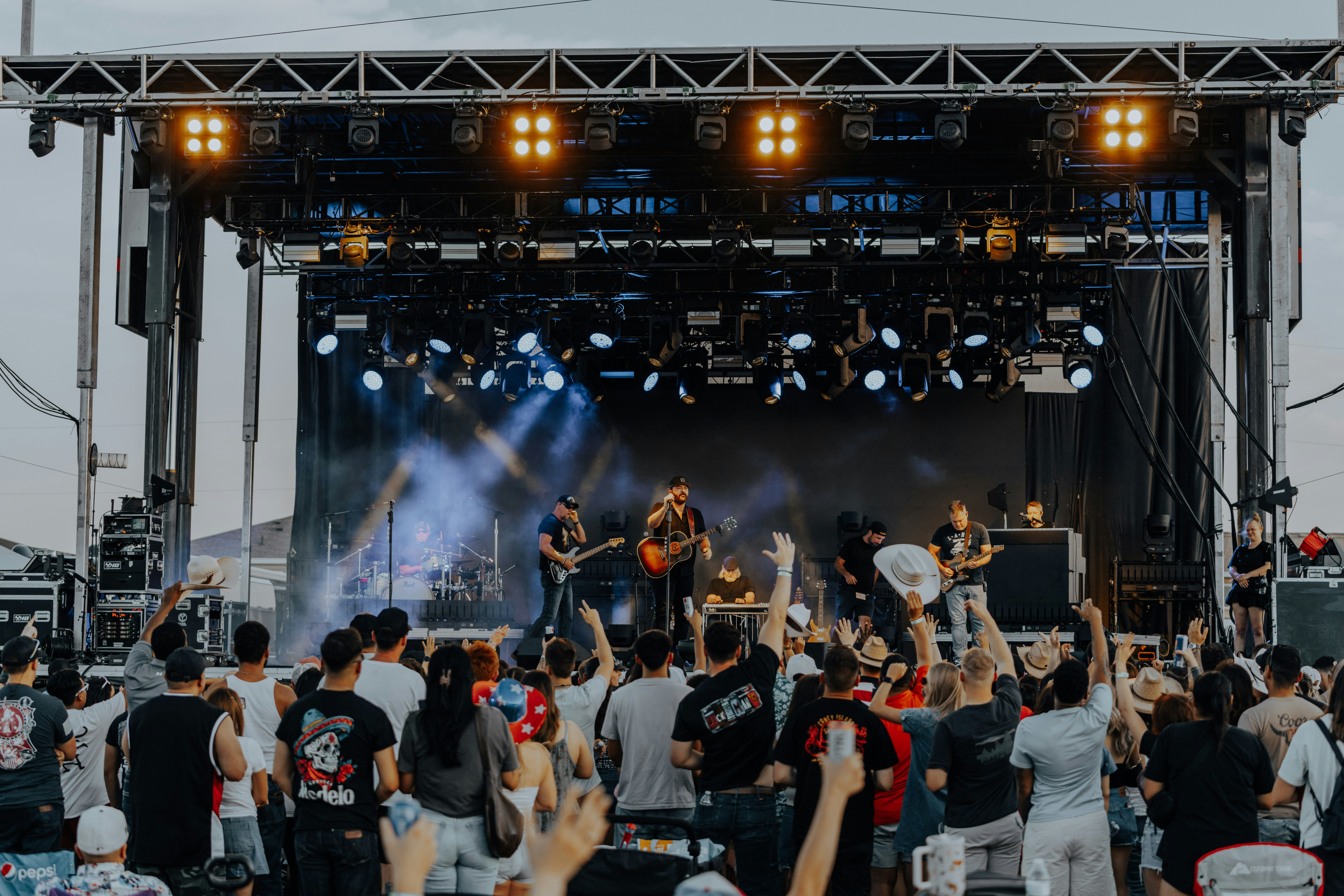 Mid-Stage Pulse: A Live Rock Moment Frozen in Front-Row Glow