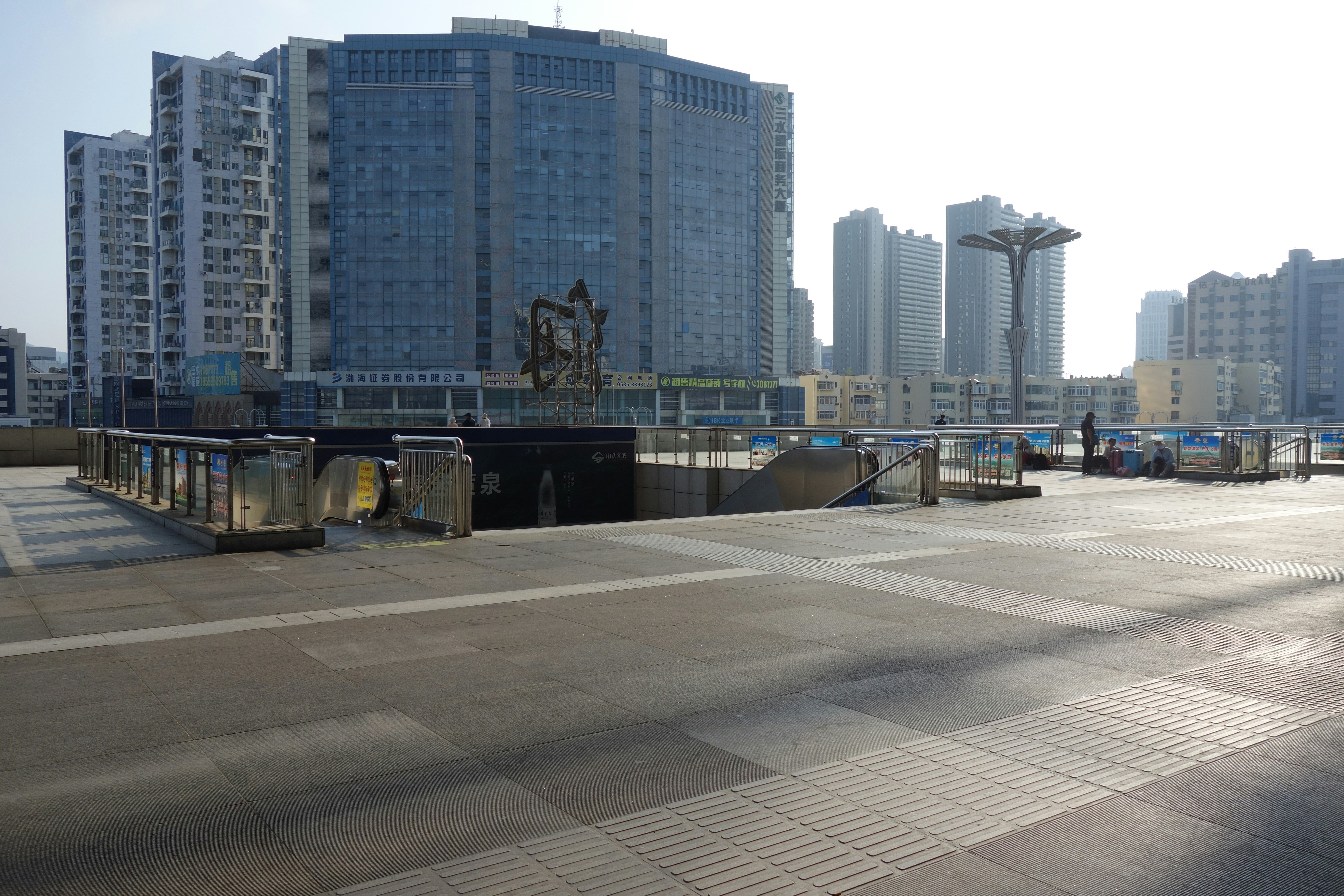 City Plaza overcast: concrete textures and distant towers
