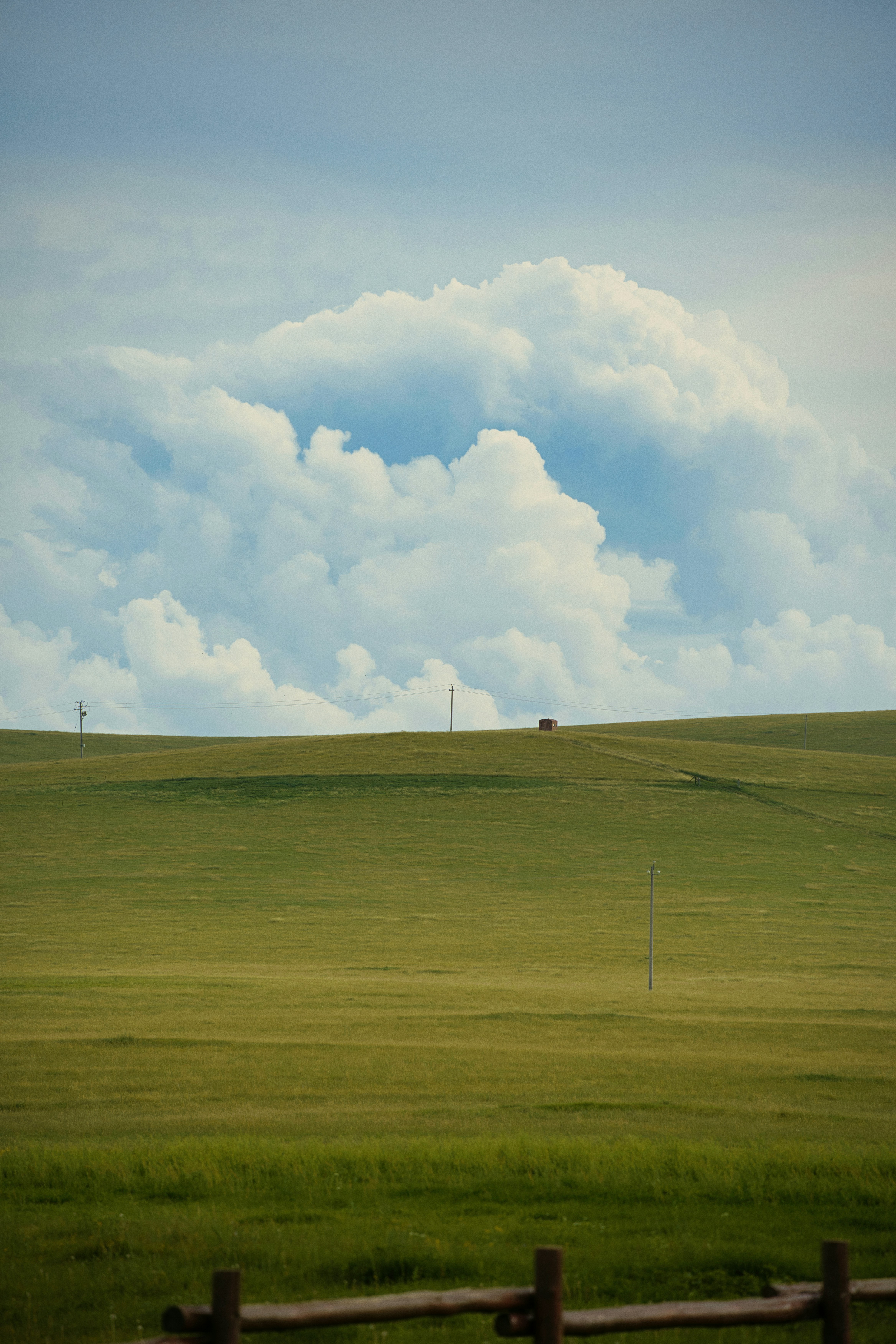 Horizon on the Quiet Prairie Under a Plume of Clouds