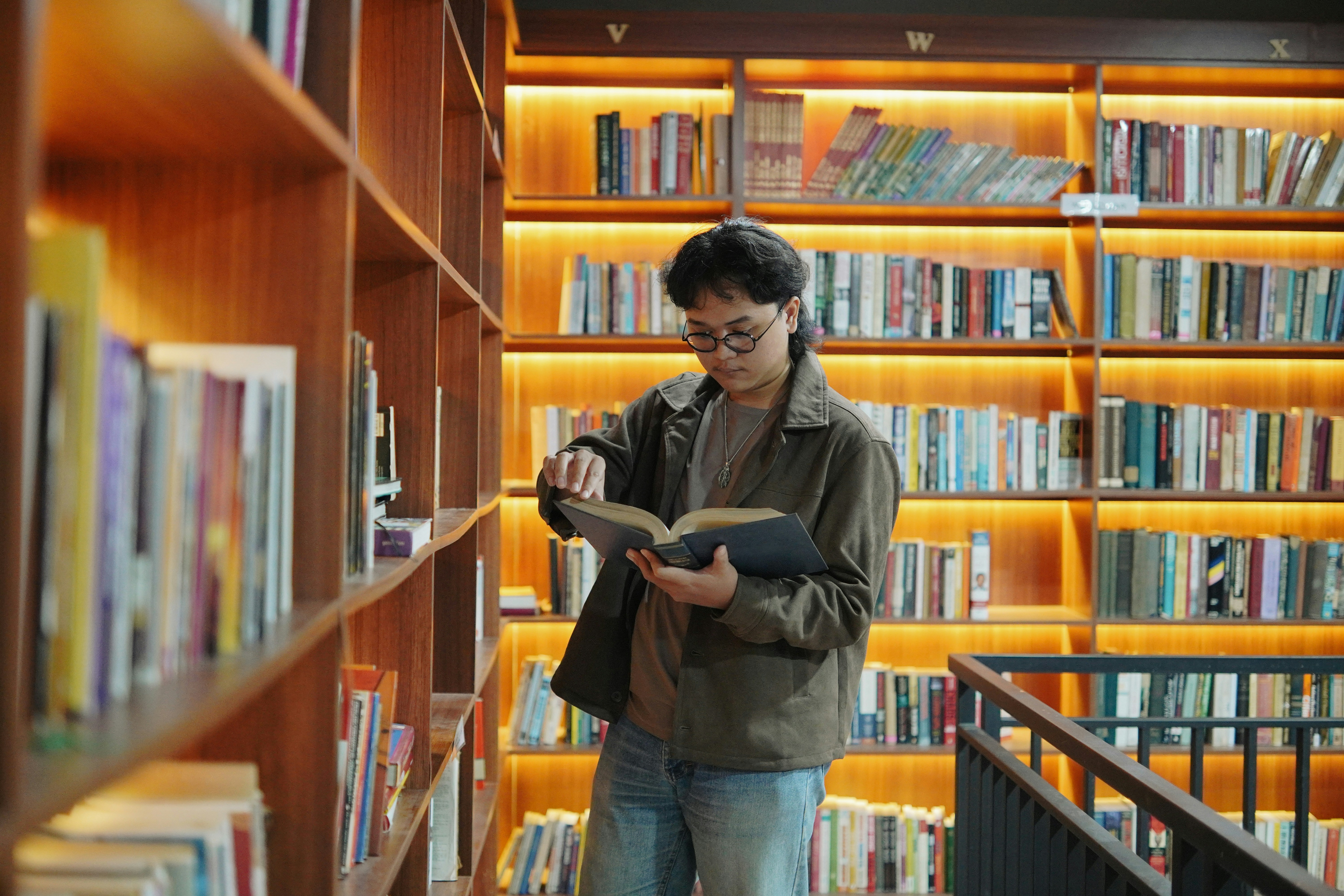 Reader in Warm Light: A Librarian Enters the Frame
