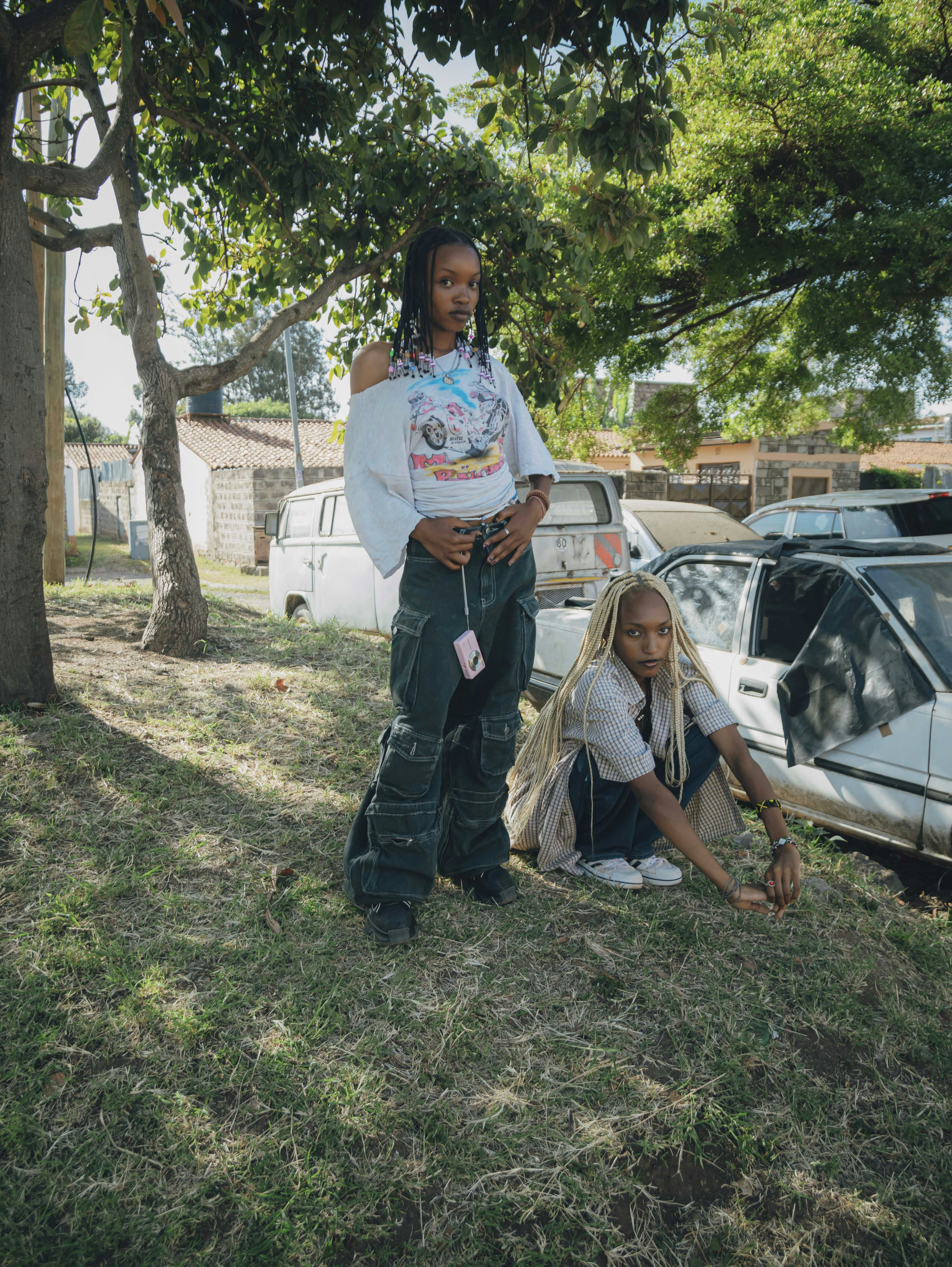 Two Friends in Shade: Quiet Confidence Under a Sprawling Tree