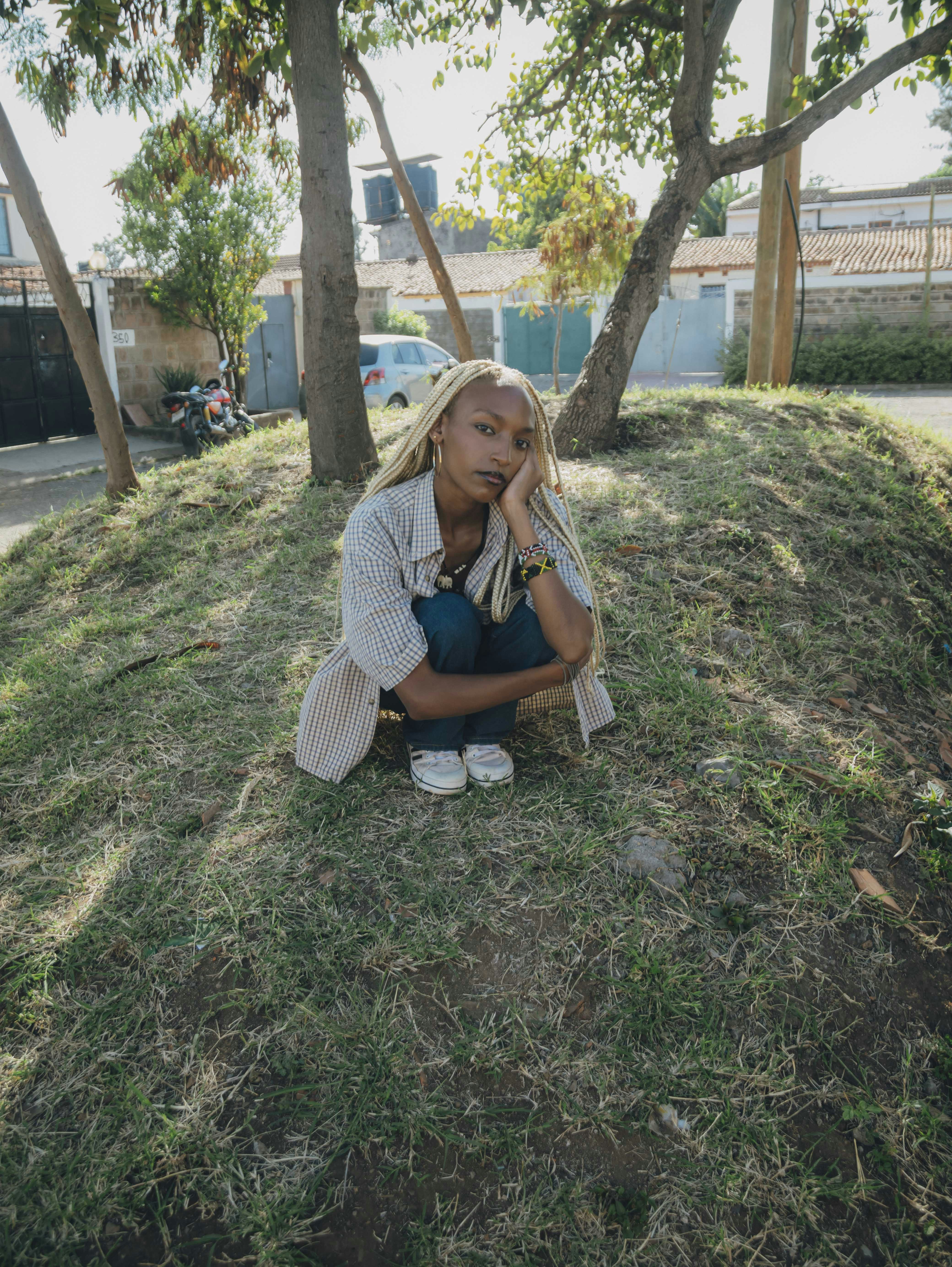 Sitting on the Hill: A Quiet Moment Beneath the Shade