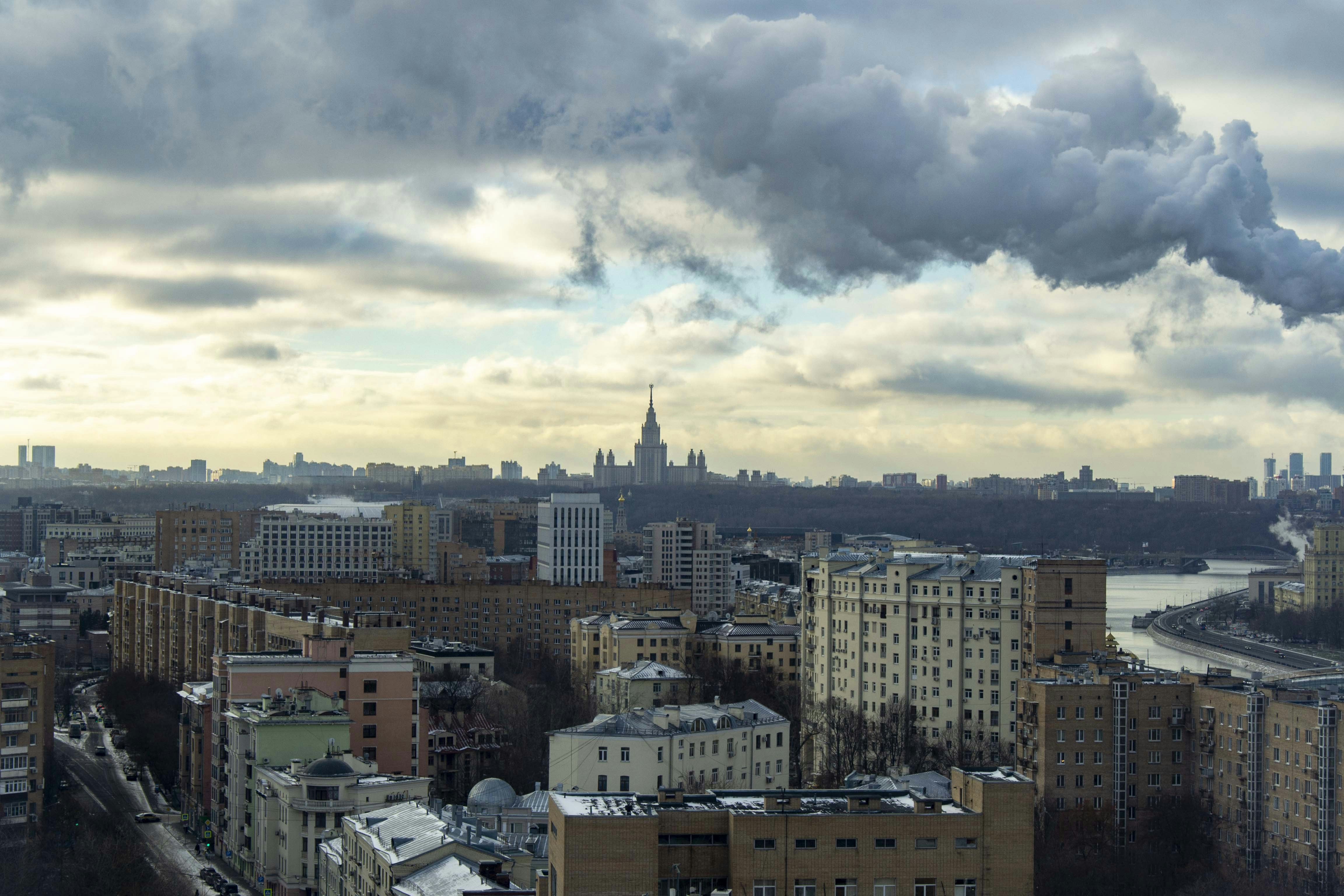Industrial Skyline Under a Break in the Clouds