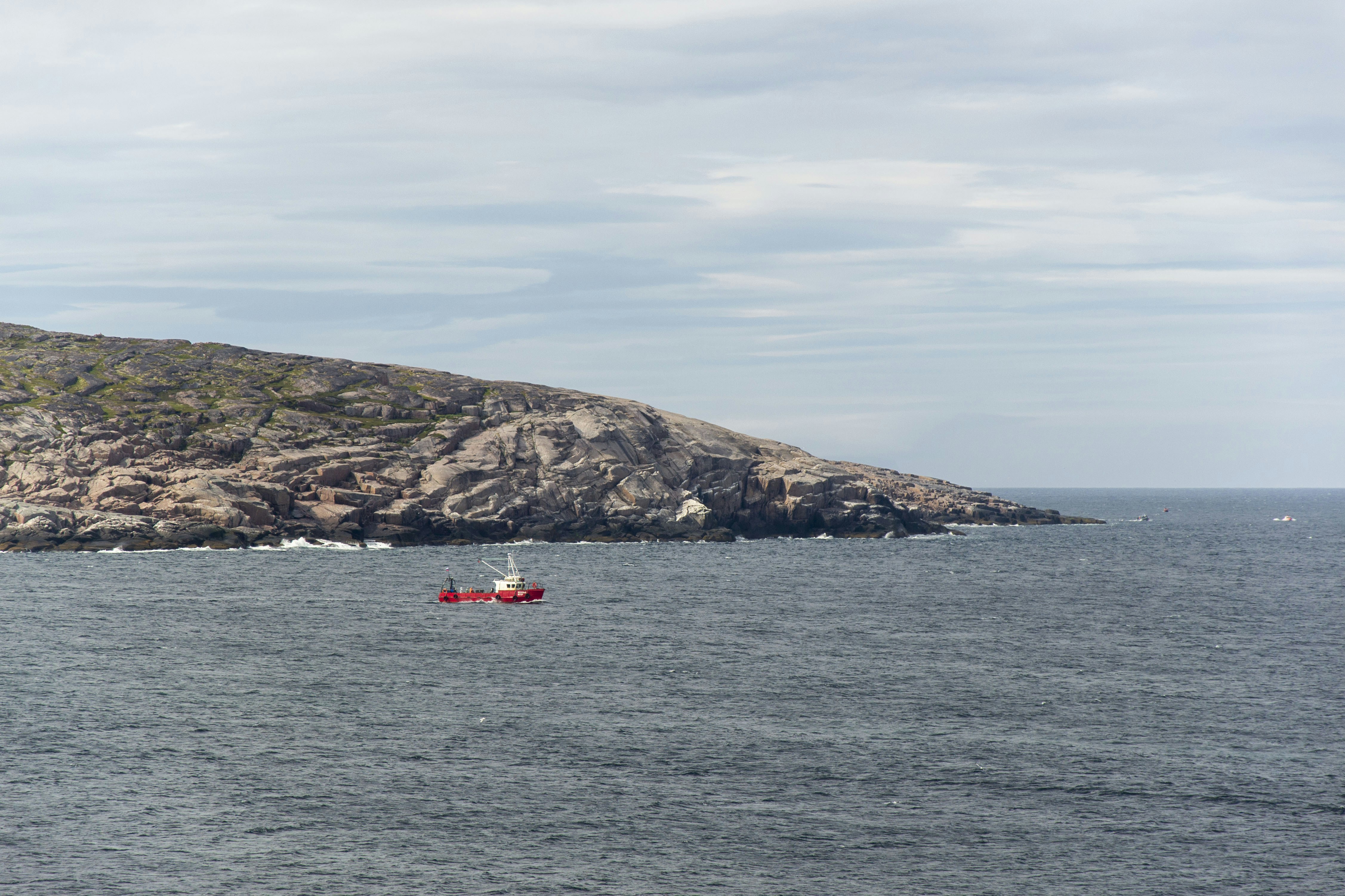 Red Boat in Quiet Coastal Calm