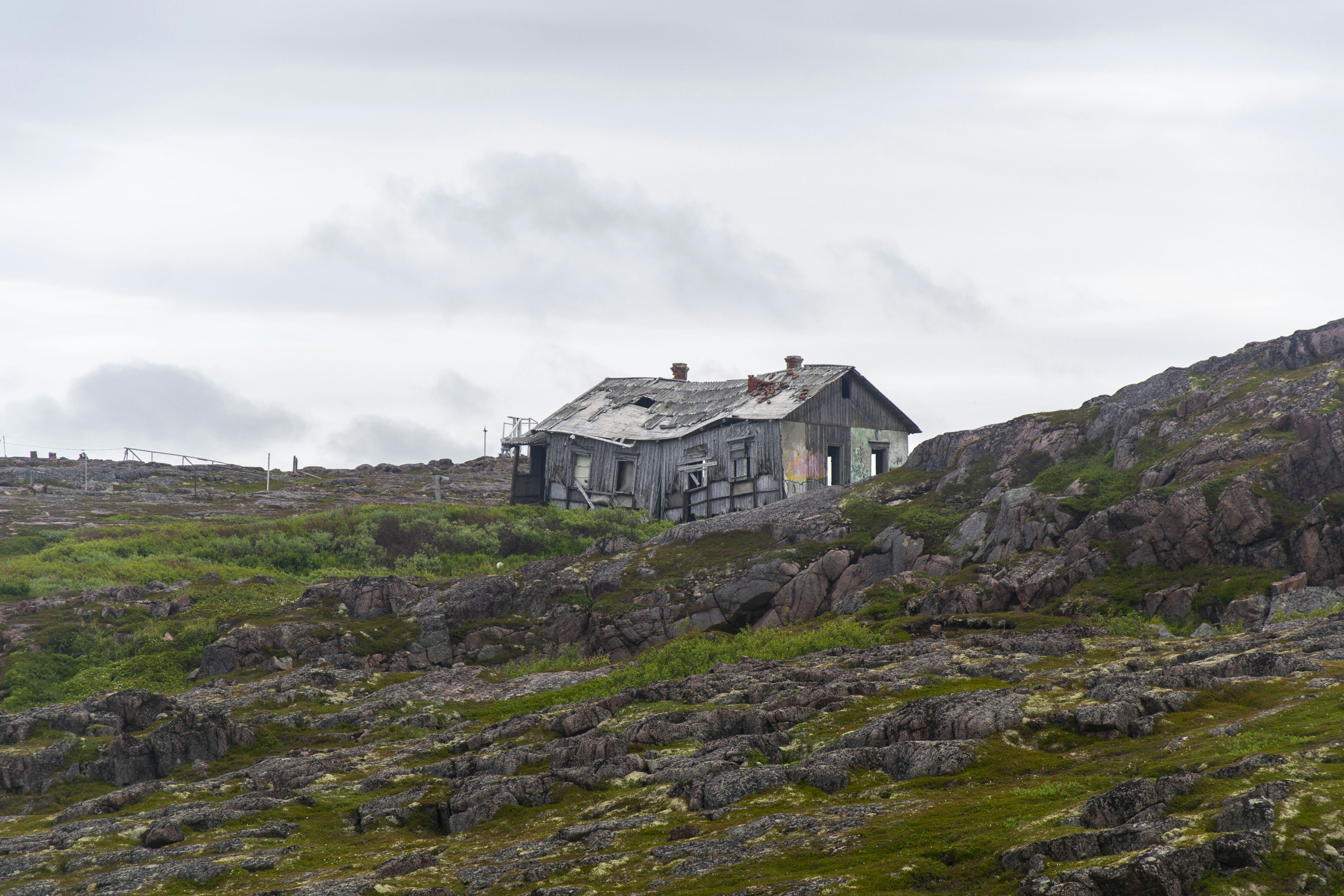 Abandoned Highland Cabin on Weathered Terrains