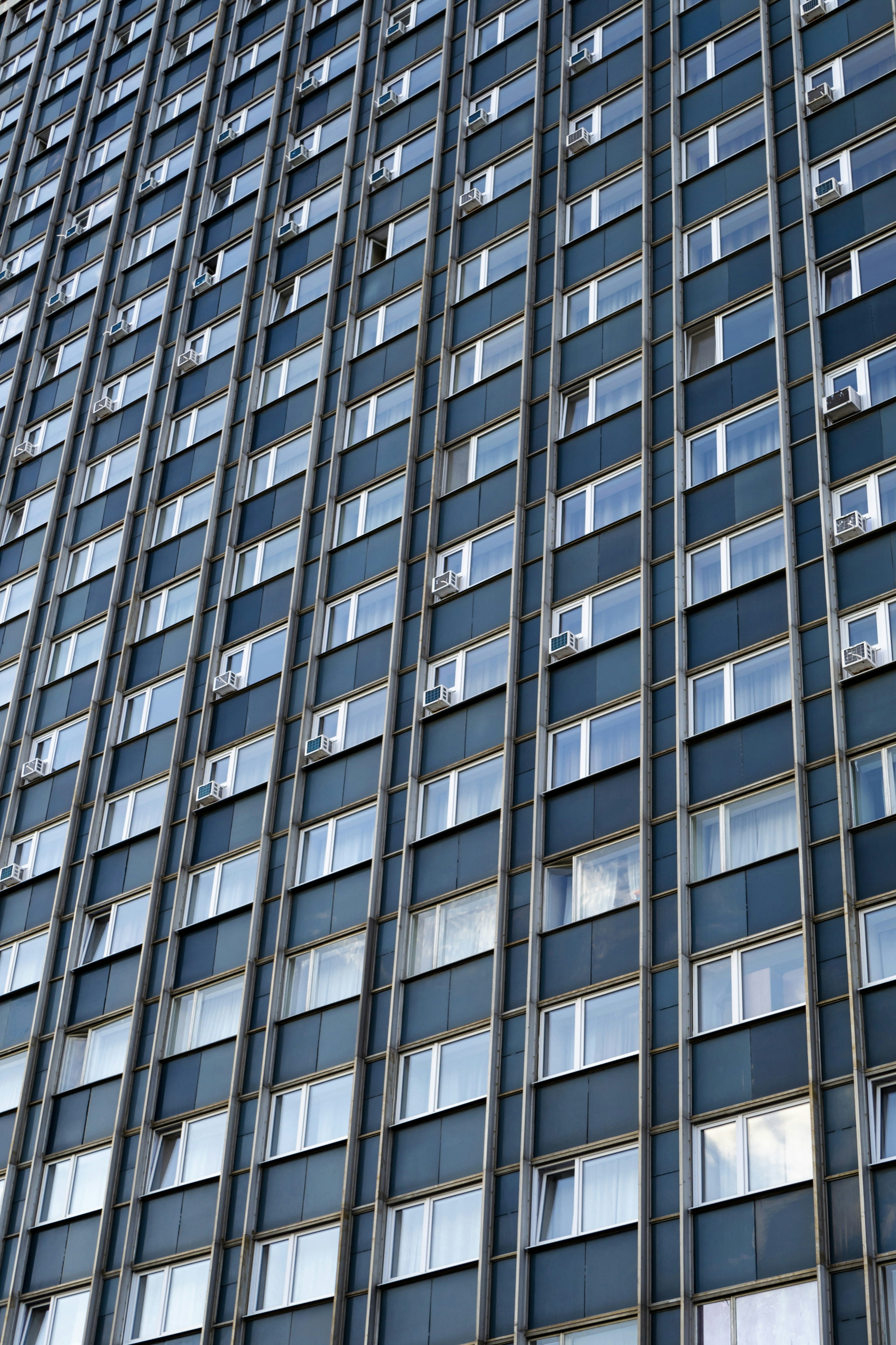 Grid of Glass and Steel: Repeating Windows in a City Facade