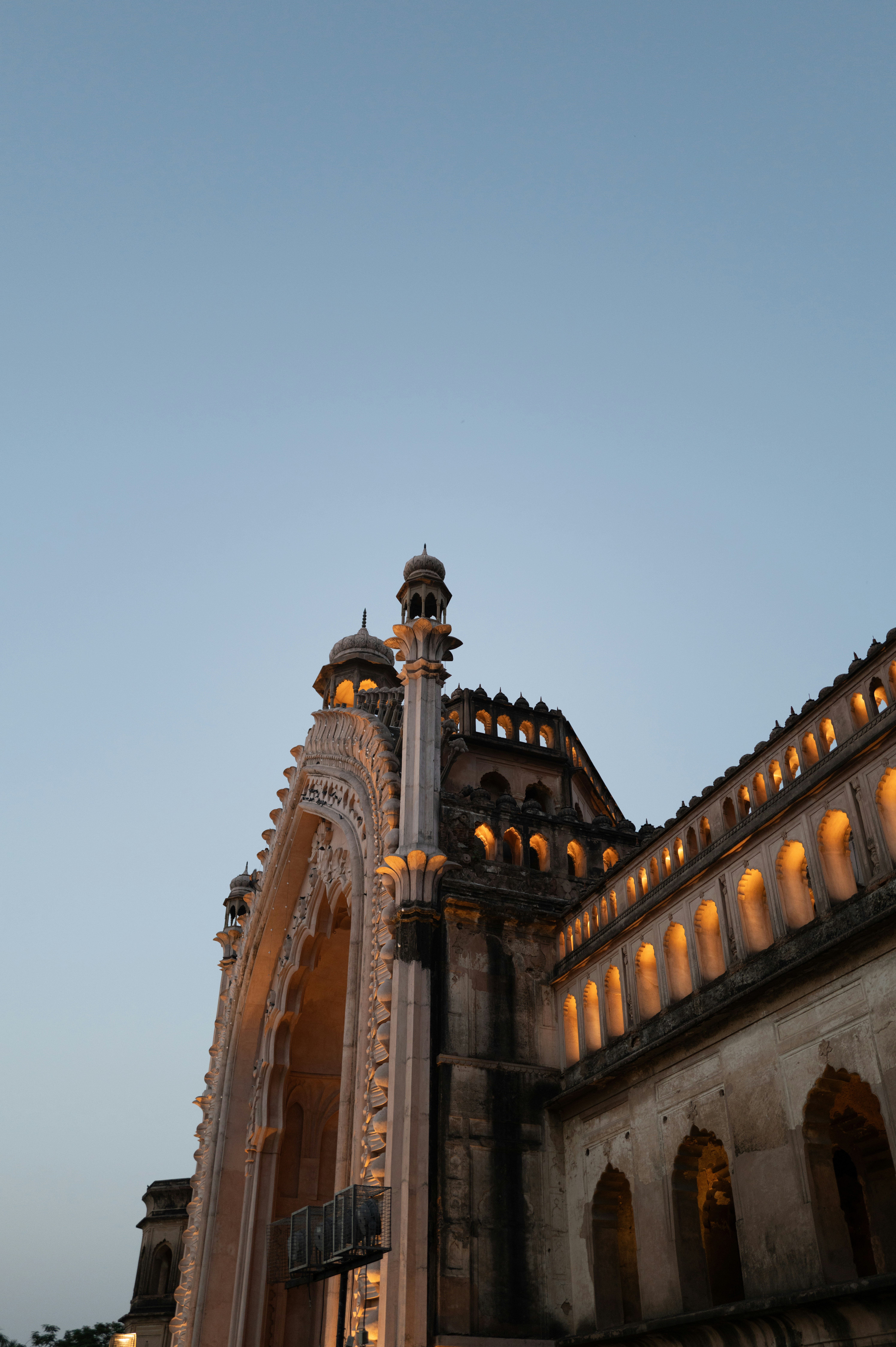 Arched Facade at Dusk: A Historic Gateway Illuminated
