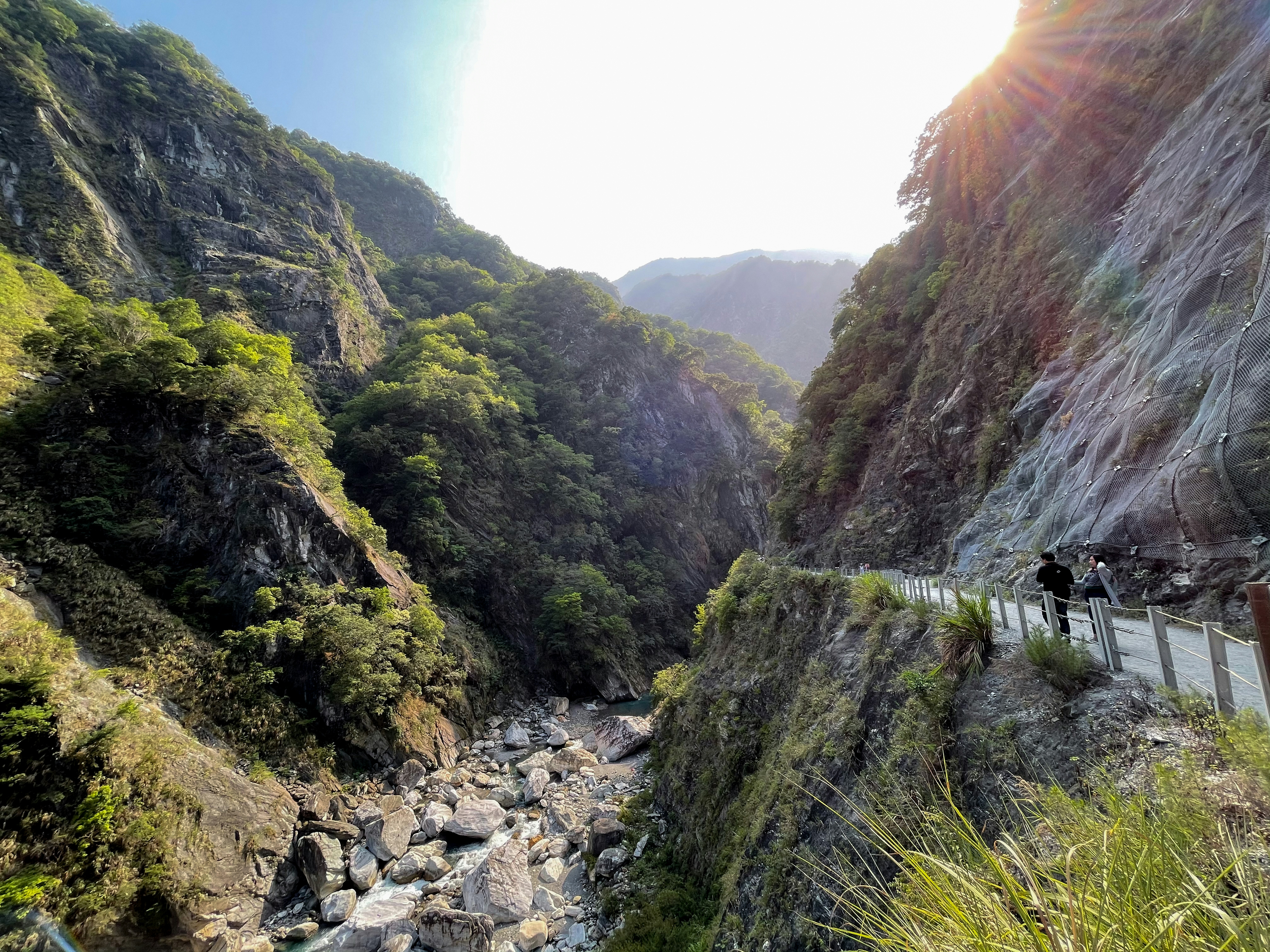 Sunlit Pass: Cliffside Path Through a Narrow Gorge