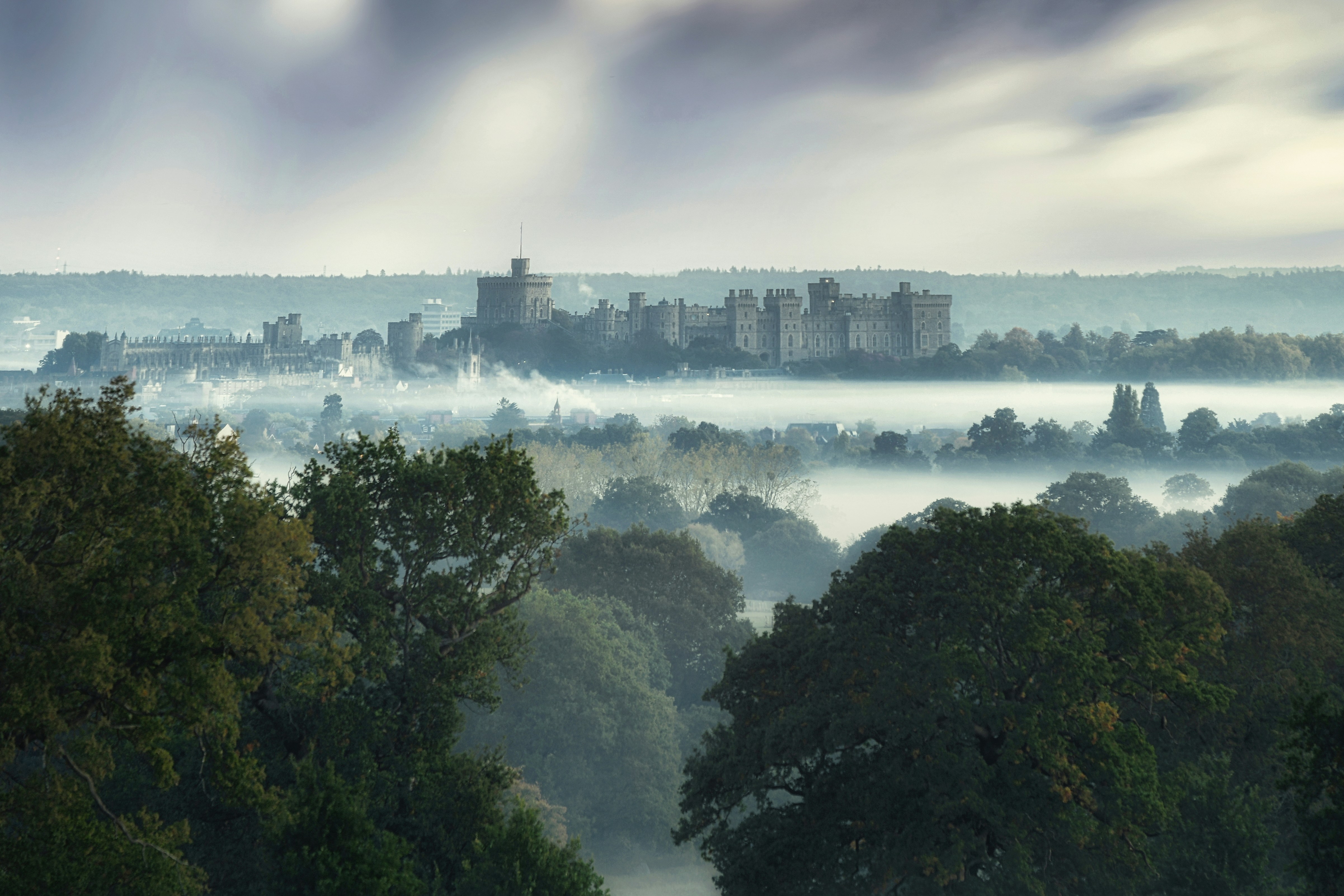 Morning Mist Over the City: A Quiet Riverside Awakening