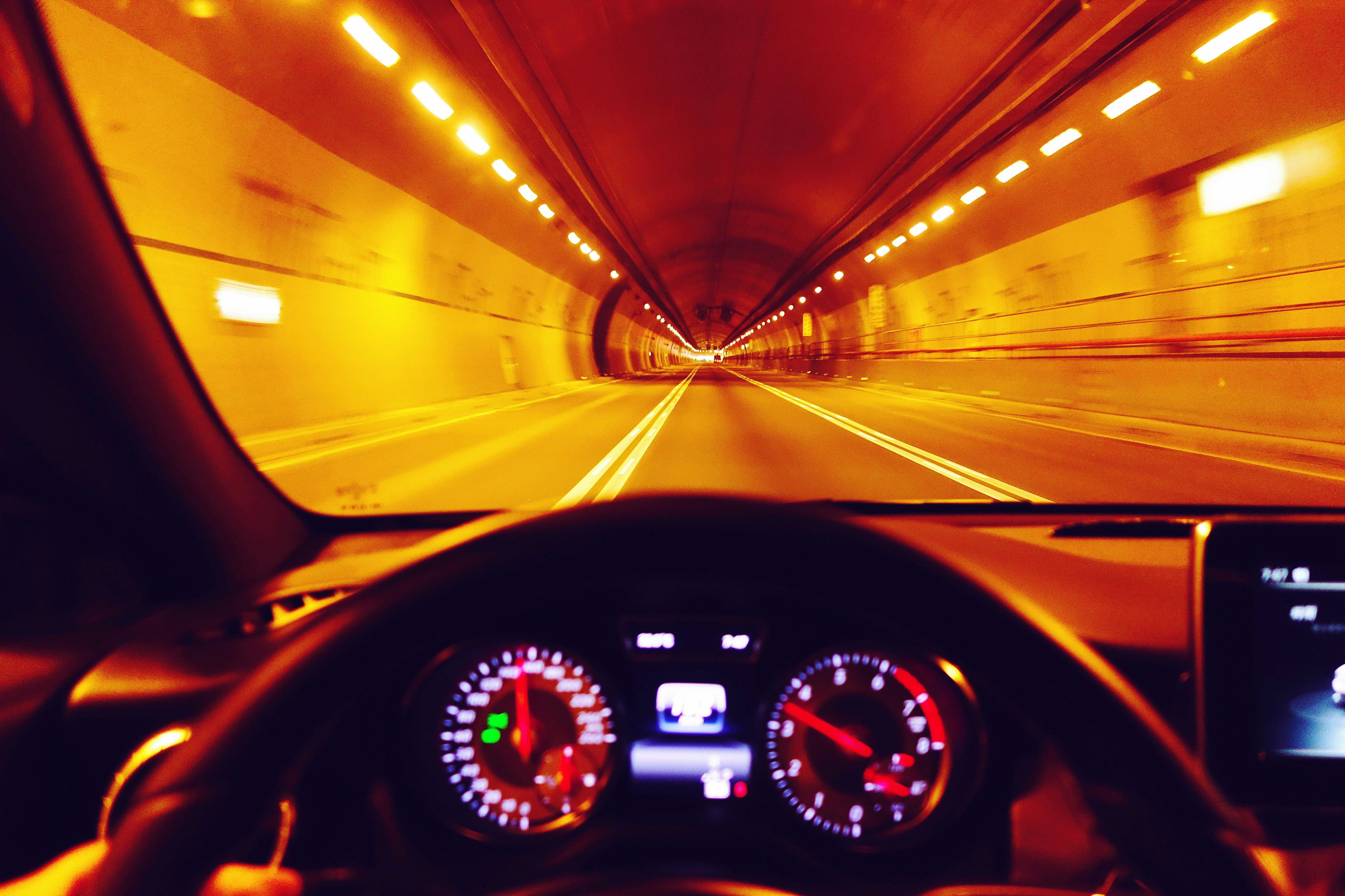 Streaking Through the Final Turn: Cockpit View from a Neon Tunnel