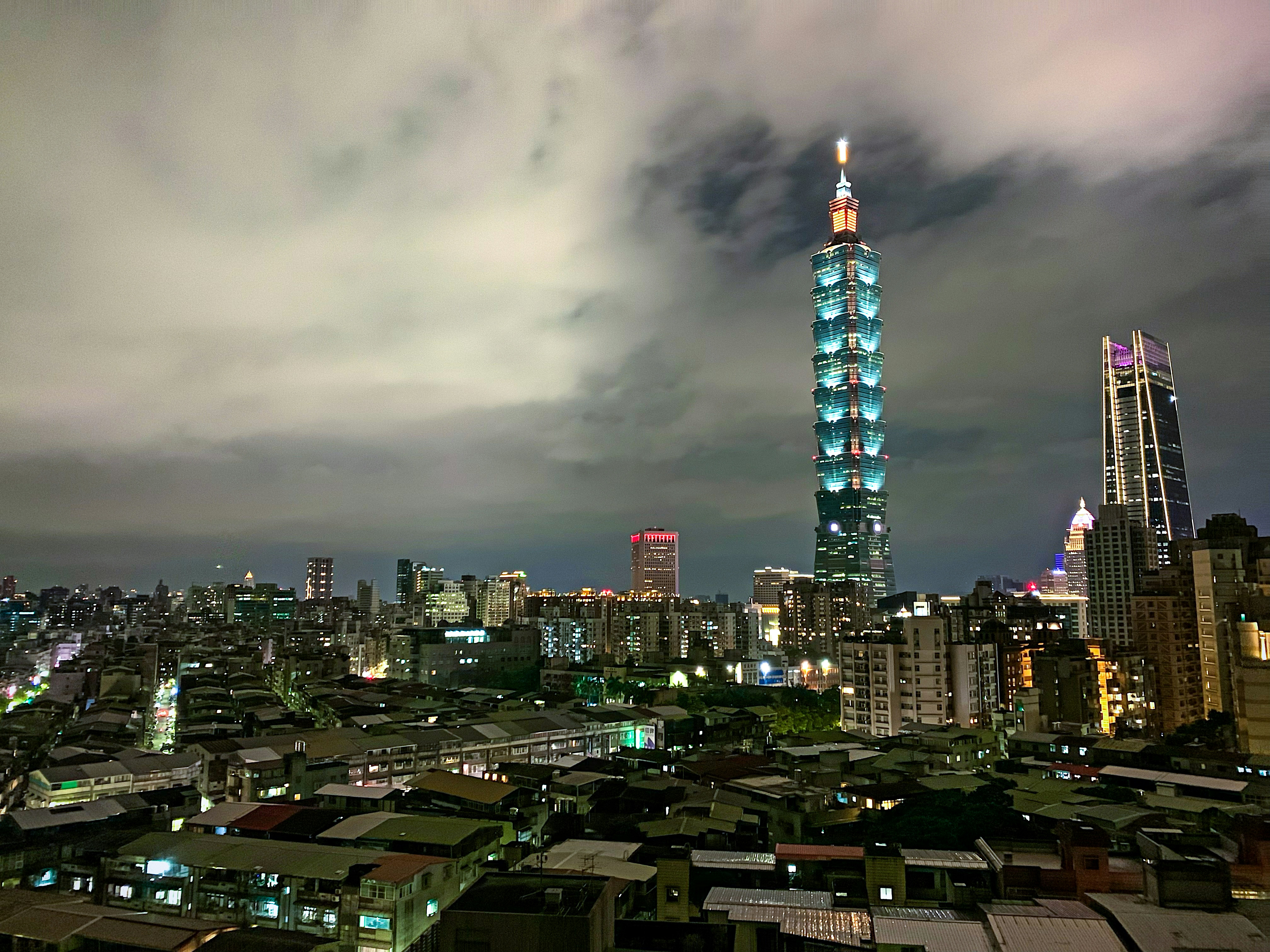 Twilight Taipei: Skyscraper Beacon Over the Quiet Ridge