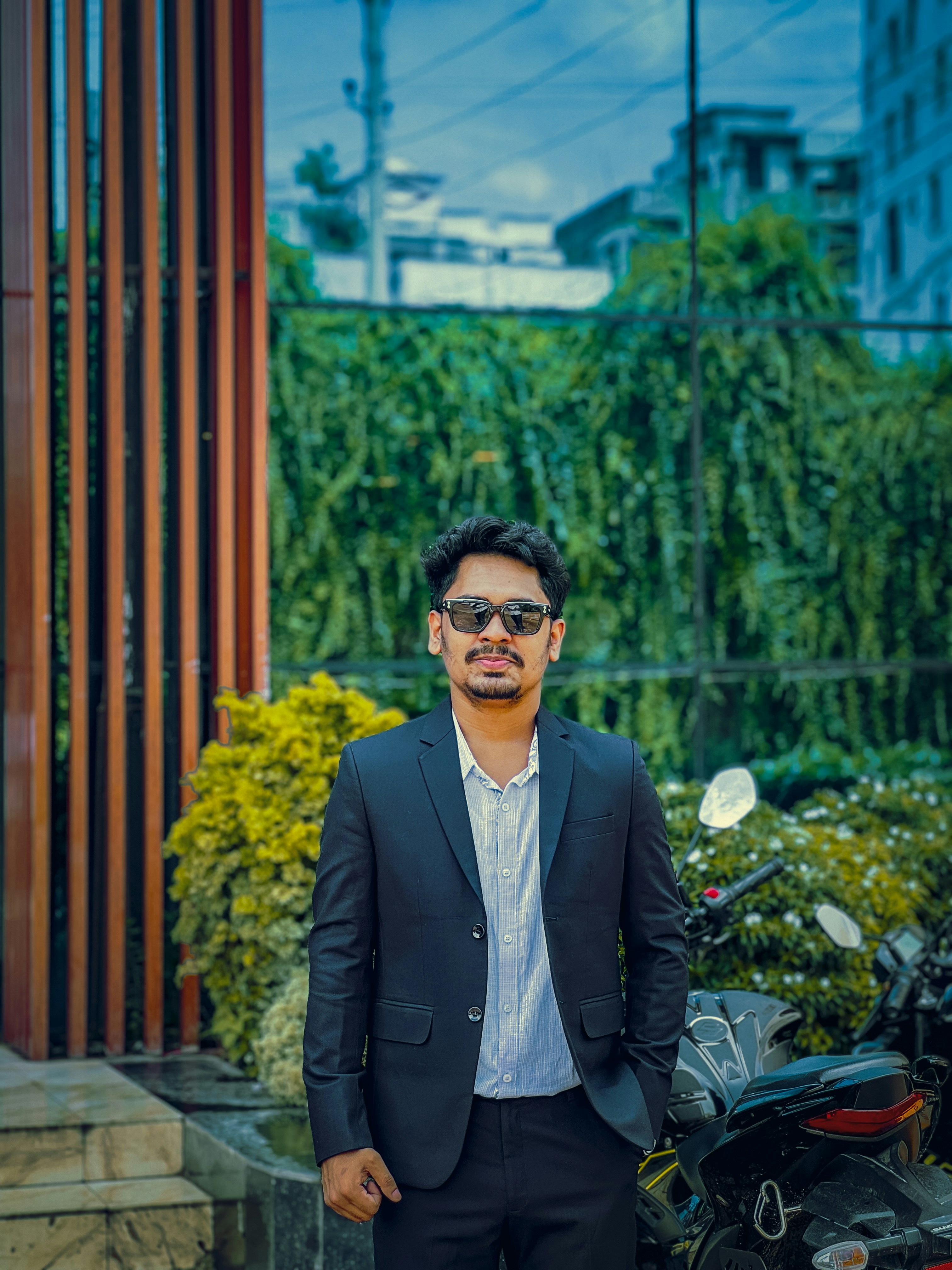 Portrait in a Modern Courtyard: A Suited Gaze