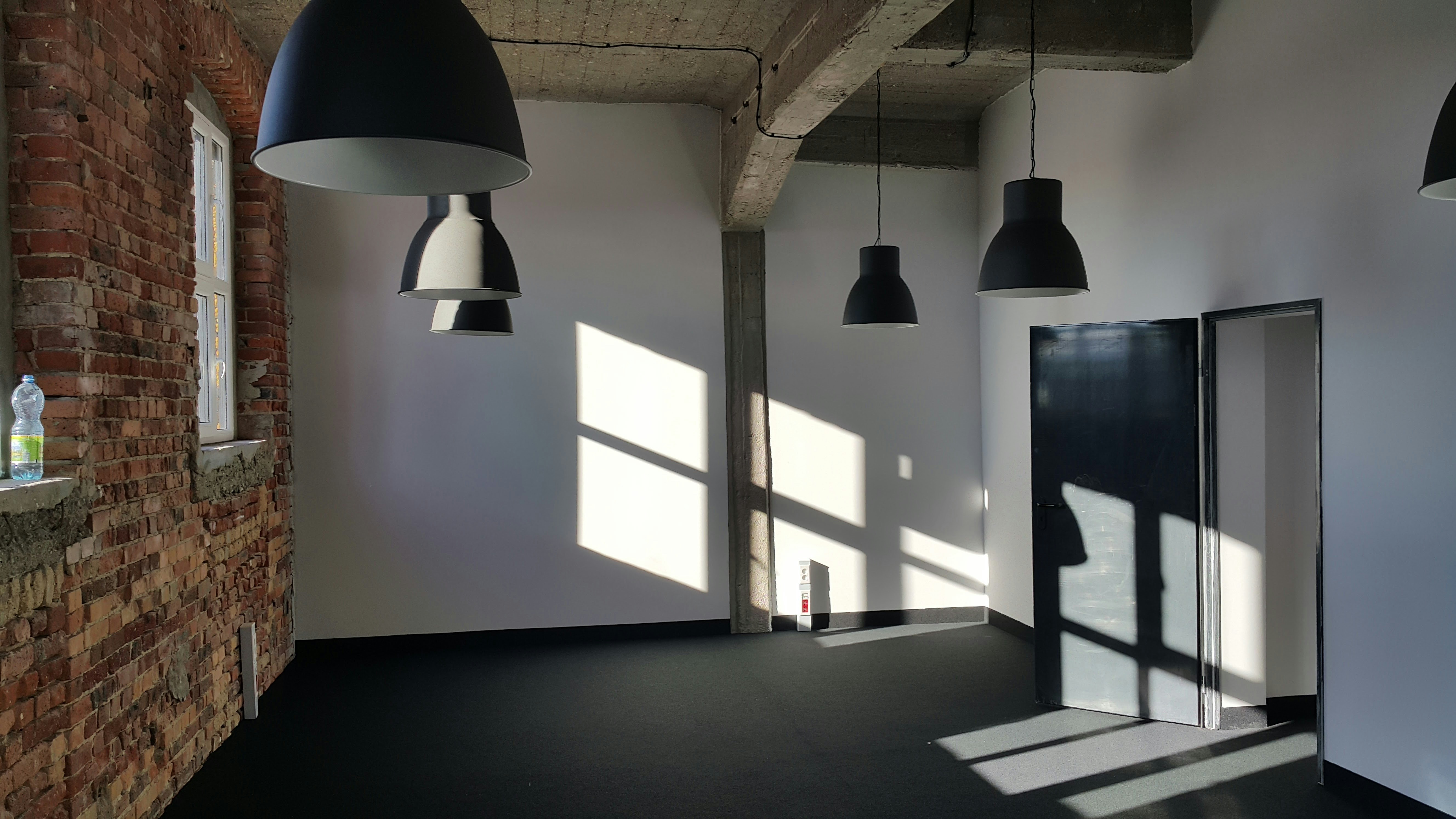 Industrial Loft with Harsh Sun Beams and Shadowed Doorway