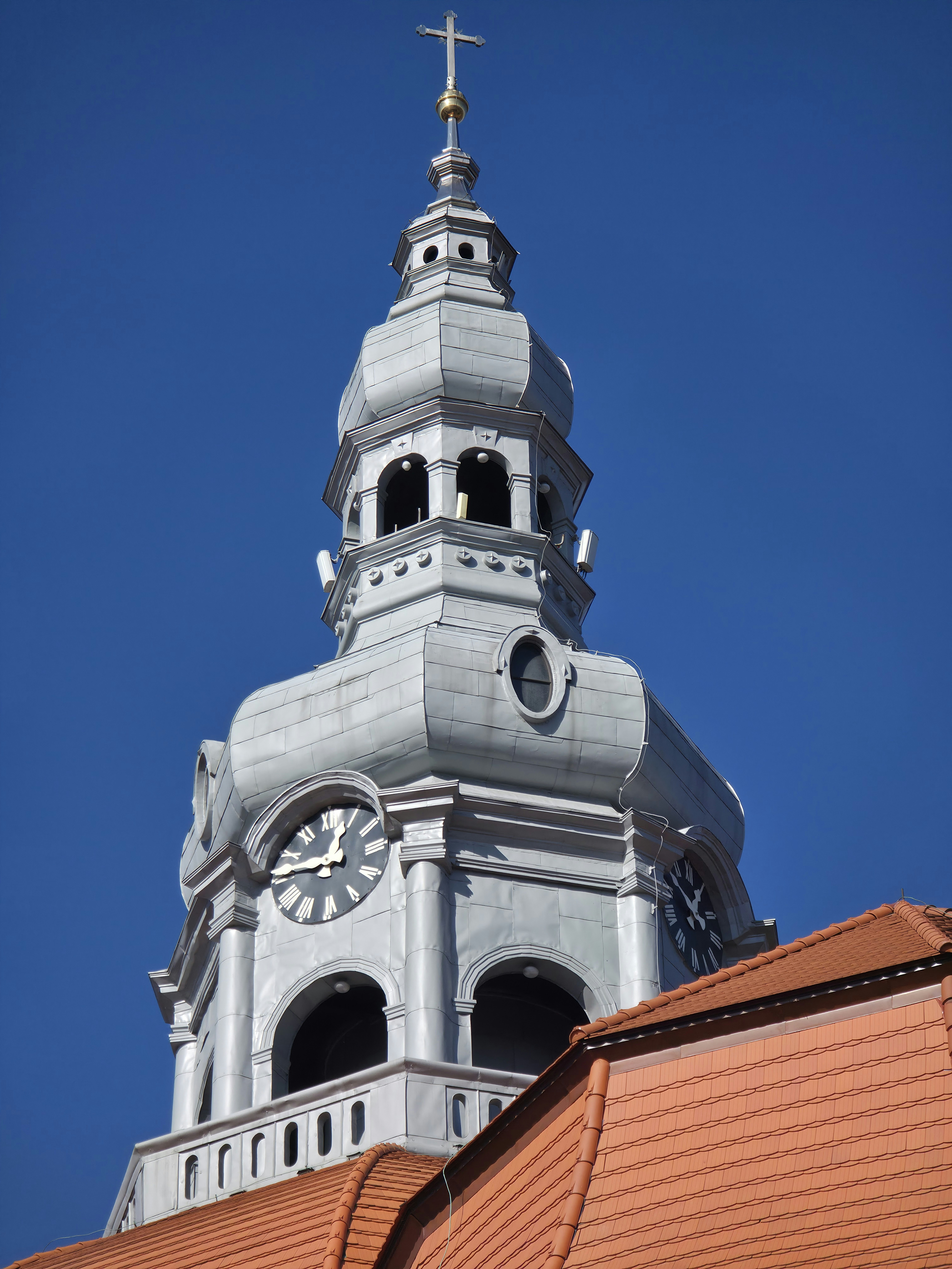 Steeple Crown in Blue: Clock Tower Pinnacle against a Clear Sky